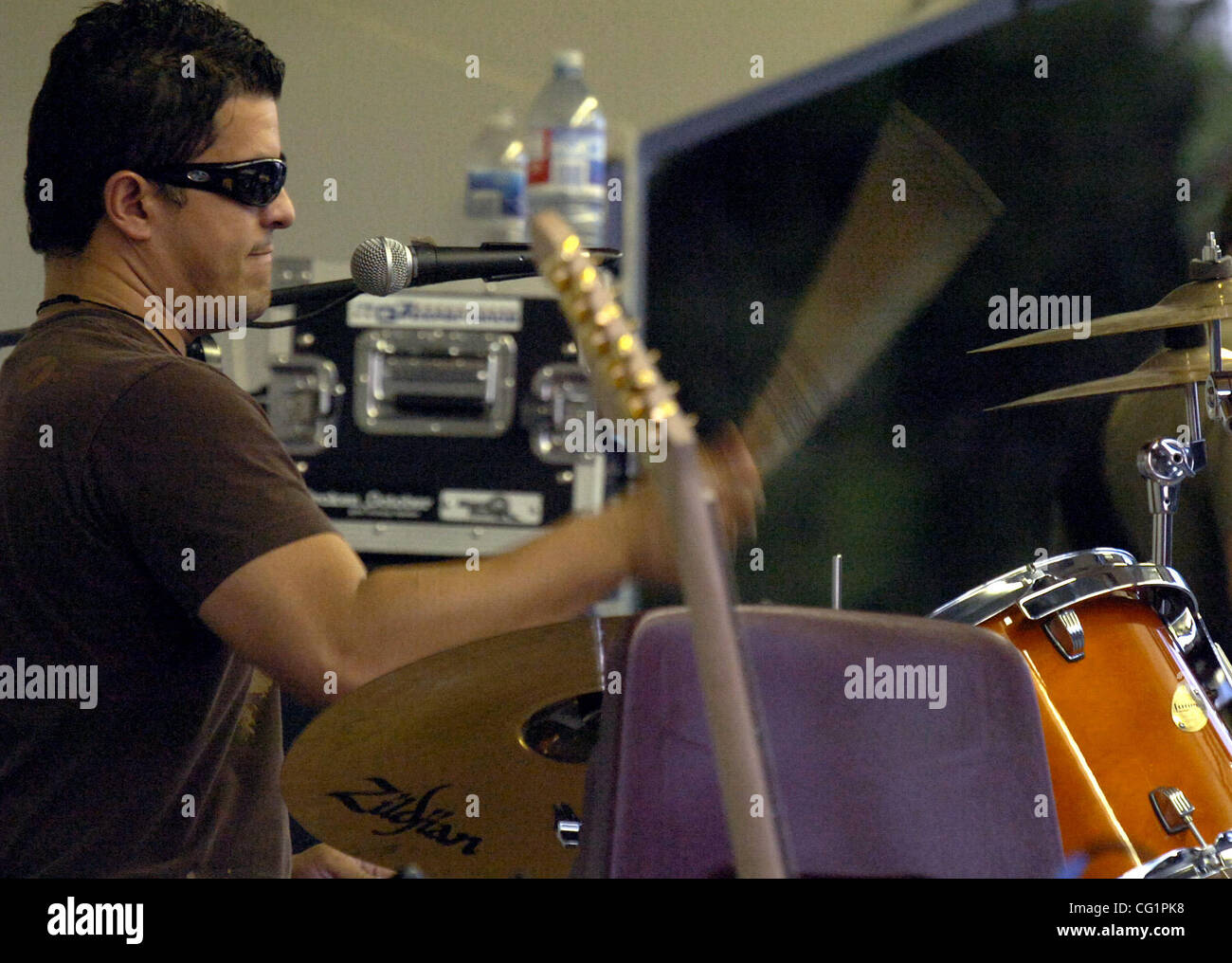 Tim Rios, of Brentwood, the drummer for local band Amberhaze, bangs on ...