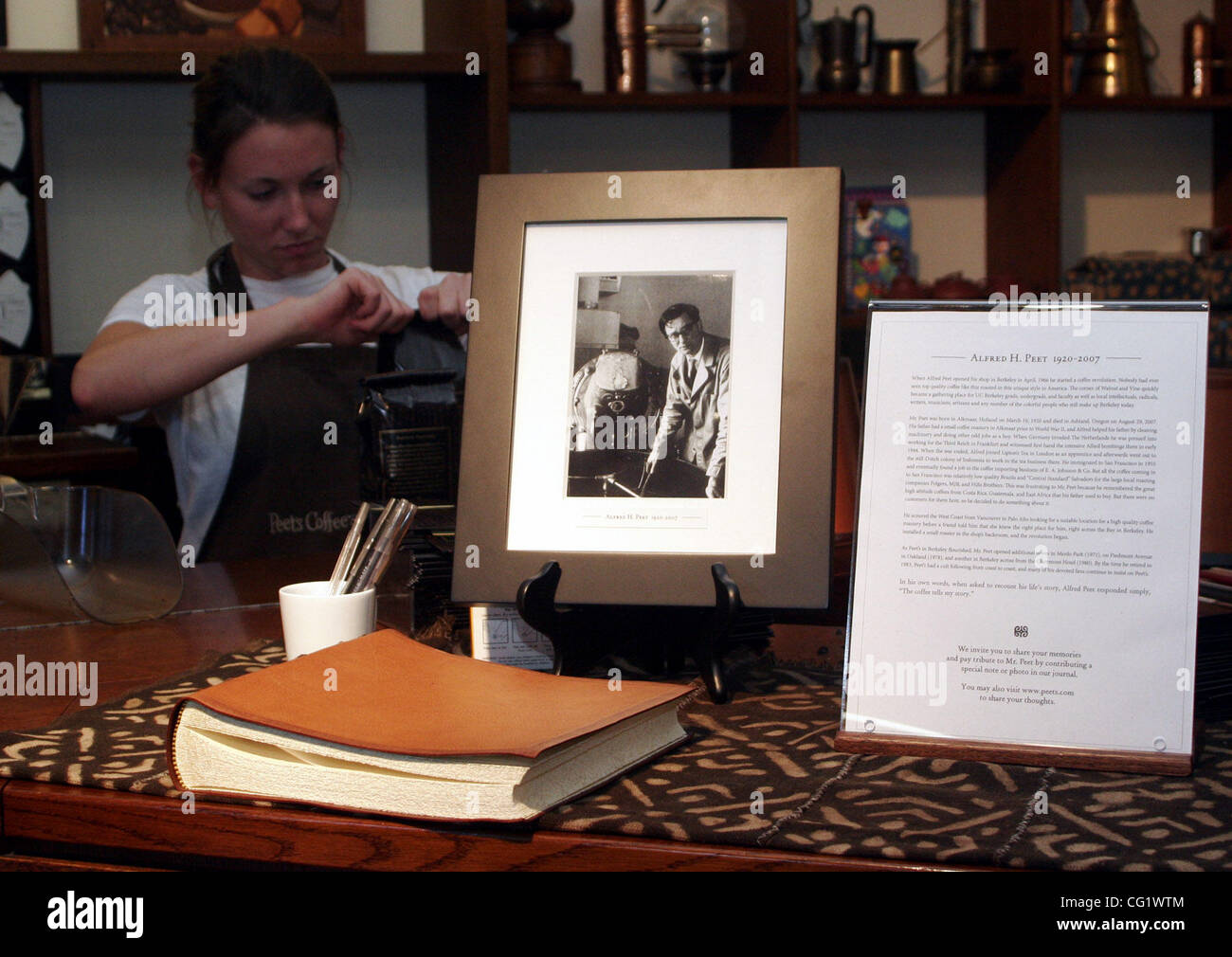Employee Shannon DeKoornbolt works behind a memorial to Peet's founder ...