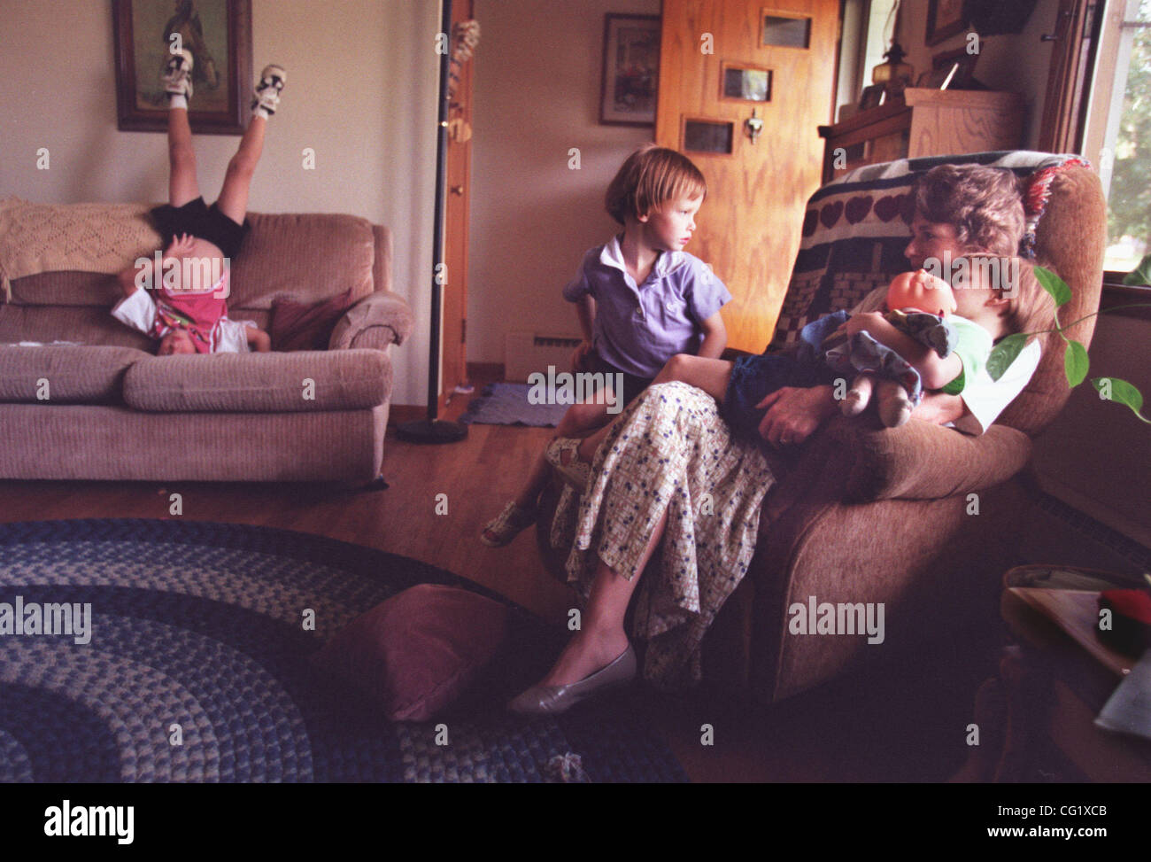 Travis (on couch) tries to attract some of the attention as Calli (left ...