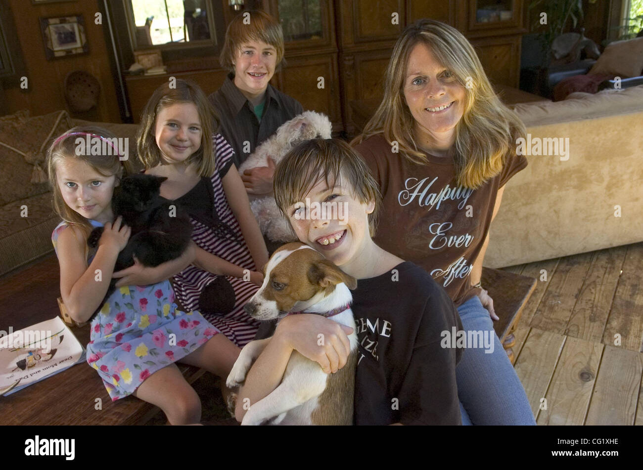 JUMP SECONDARY - Daniel Vaccaro, 12, foreground, holding Coco, was born ...