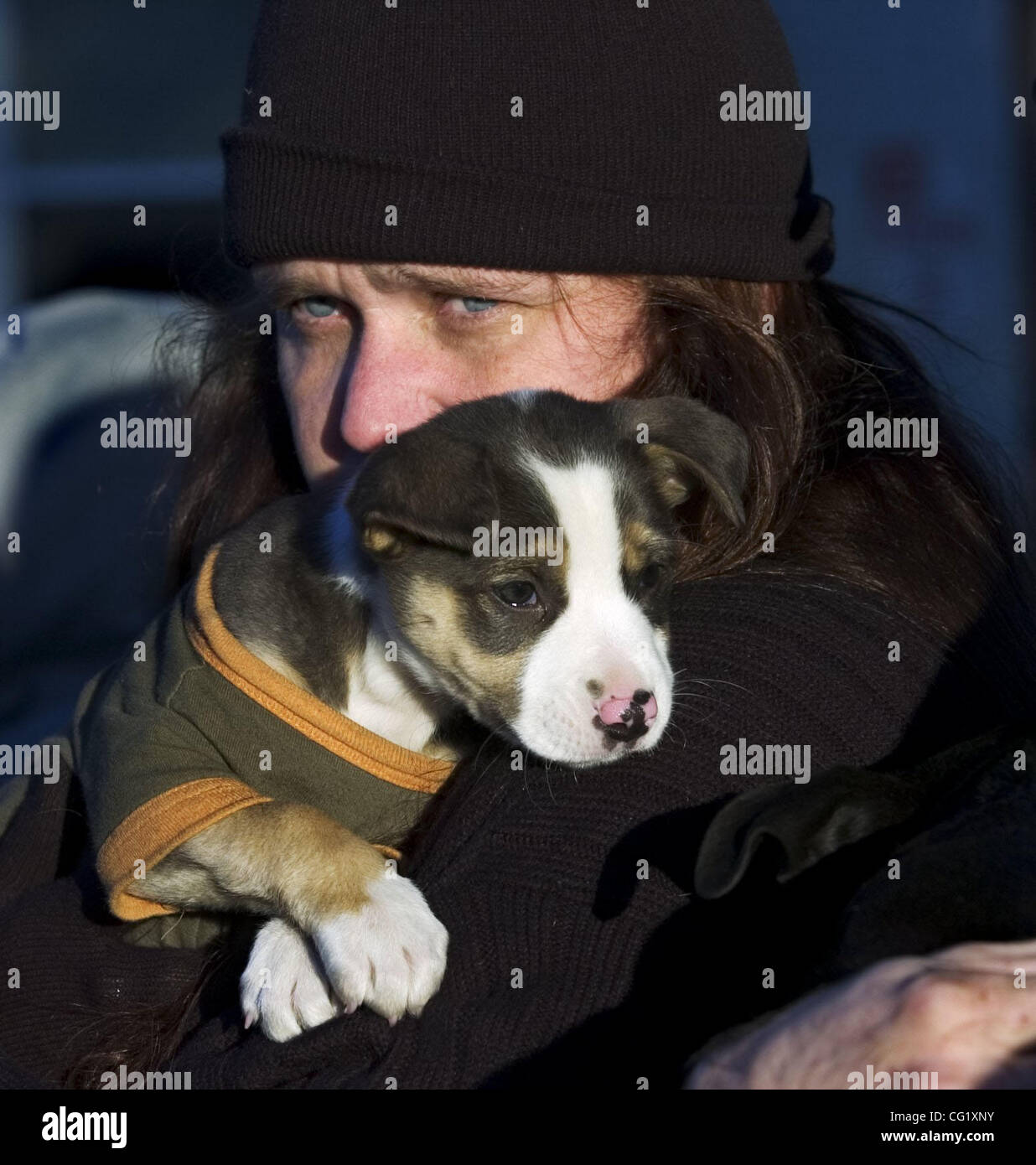 Stacie Stevenson holds Gidgett, a puppy she has had for one week, while ...