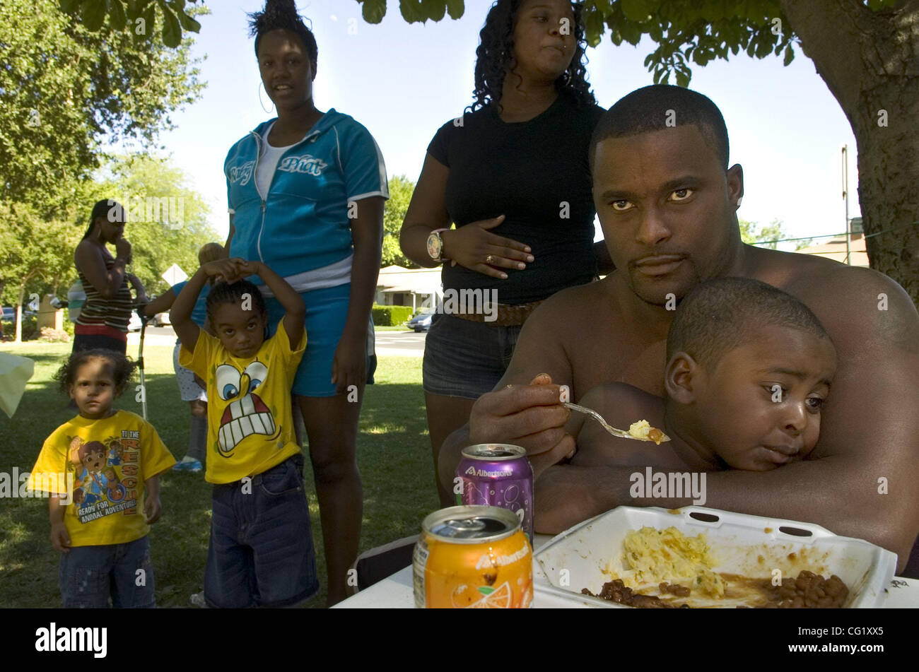 Wyatt Johnson feeds his son, Wyatt III, during his three-year-old ...