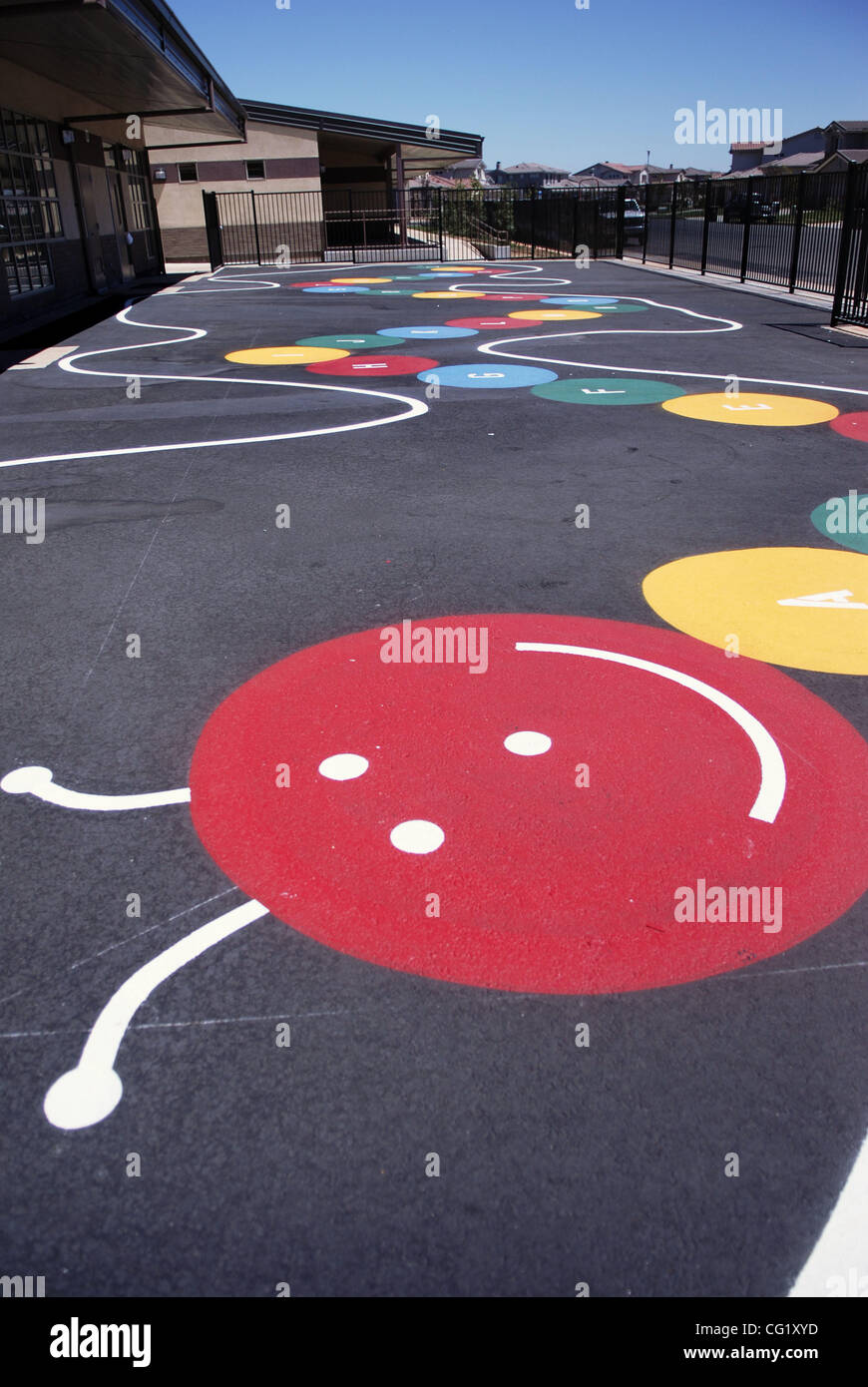 THIRD - A bright drawing decorates the pavement outside the ...