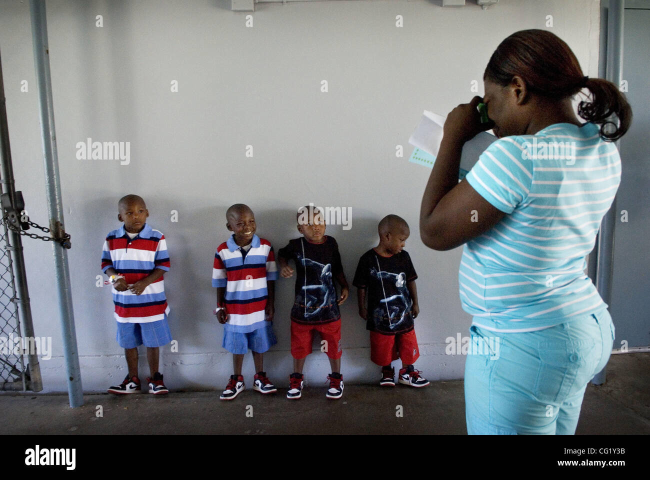 Mother Sharon Pryor, of Sacramento takes a photograph of her two sets ...