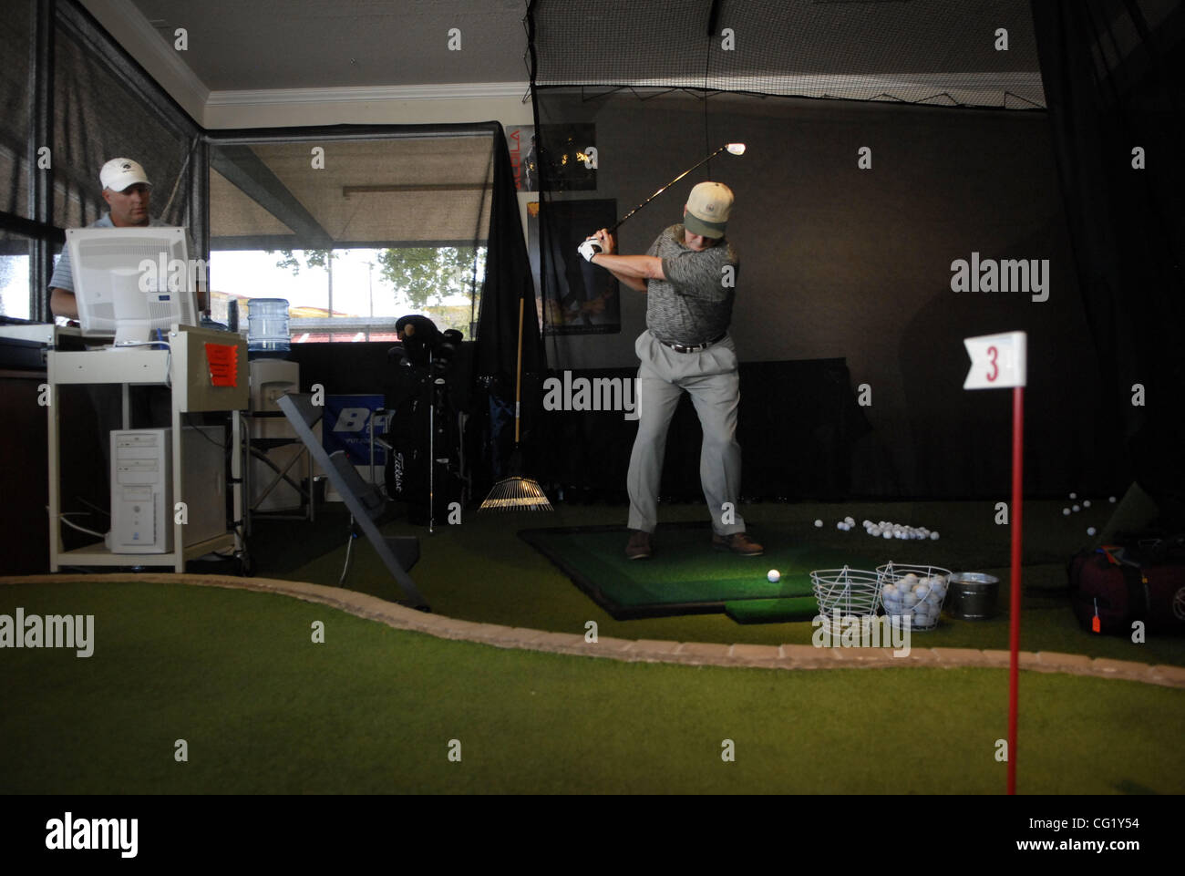 Using and computer, Scott Herringstad left, the owner of Two Rivers ...