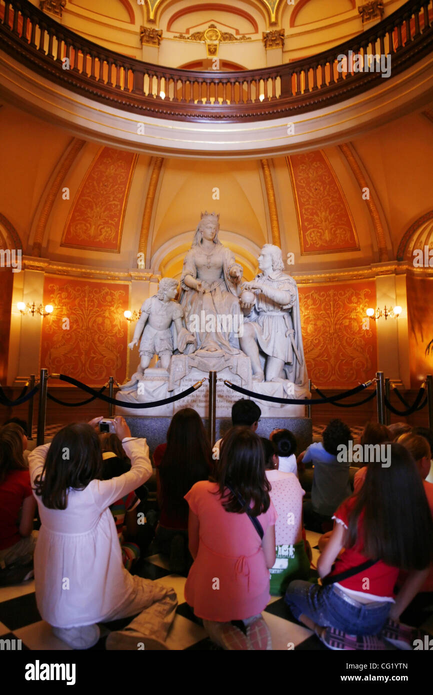 School children look at the statue of Queen Isabella in the rotunda of ...