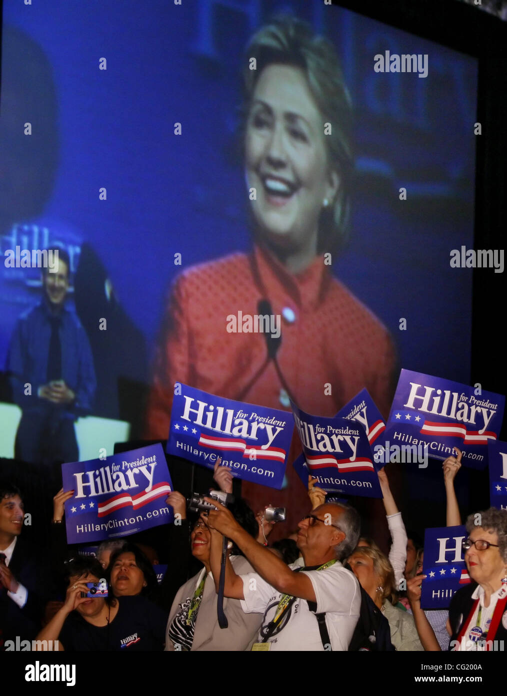Senator Hillary Clinton appears on a TV as she gives her speech during ...