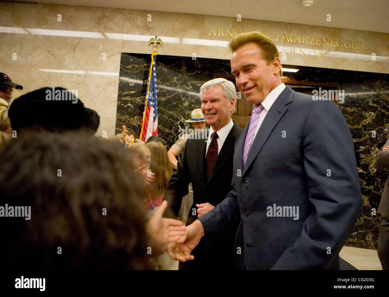 Governor Arnold Schwarzenegger introduces Dr. David Long, left, as his ...
