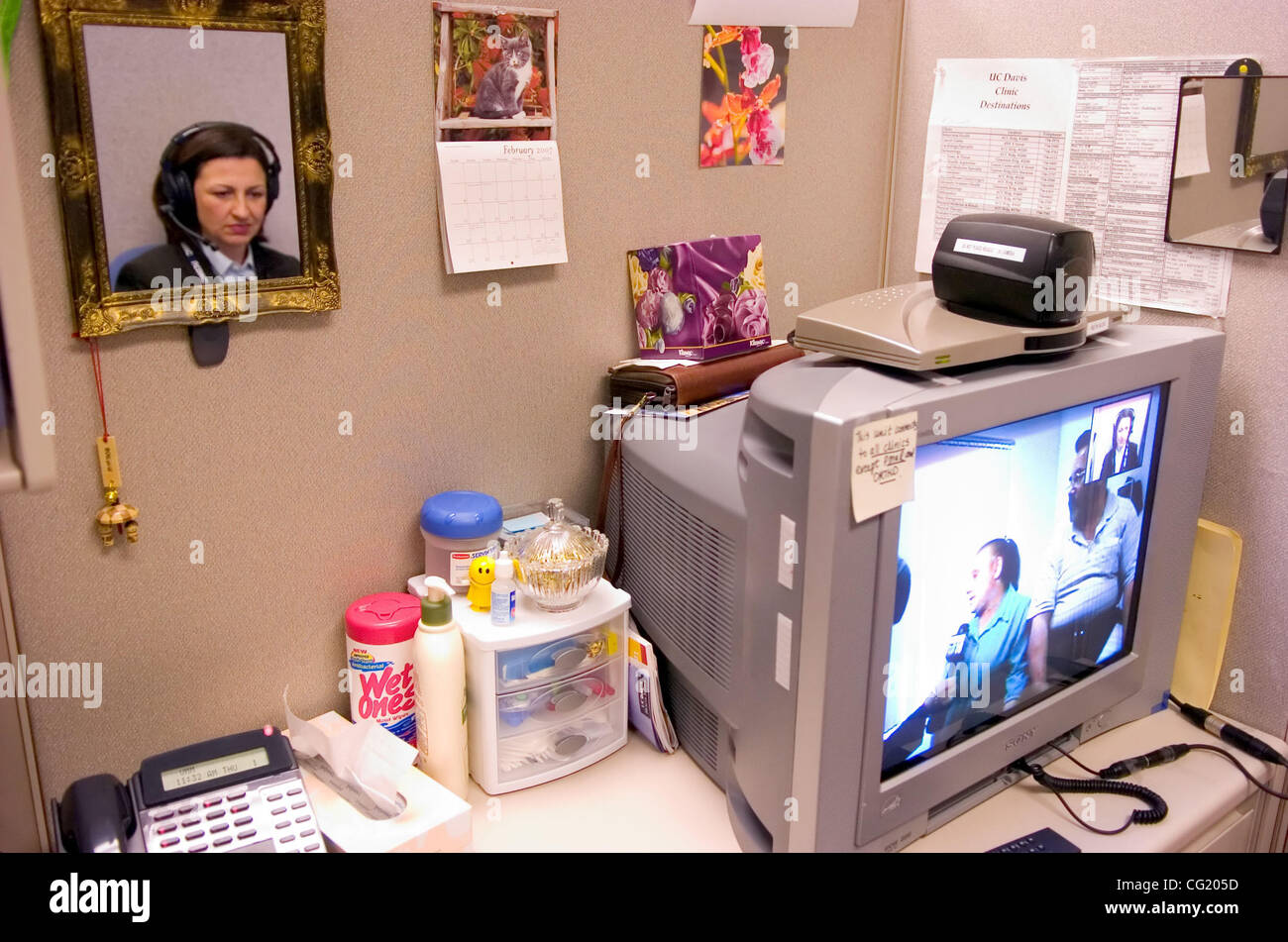 LEDE Inez Talbott interprets on a video monitor with a Dr. Sarah ...