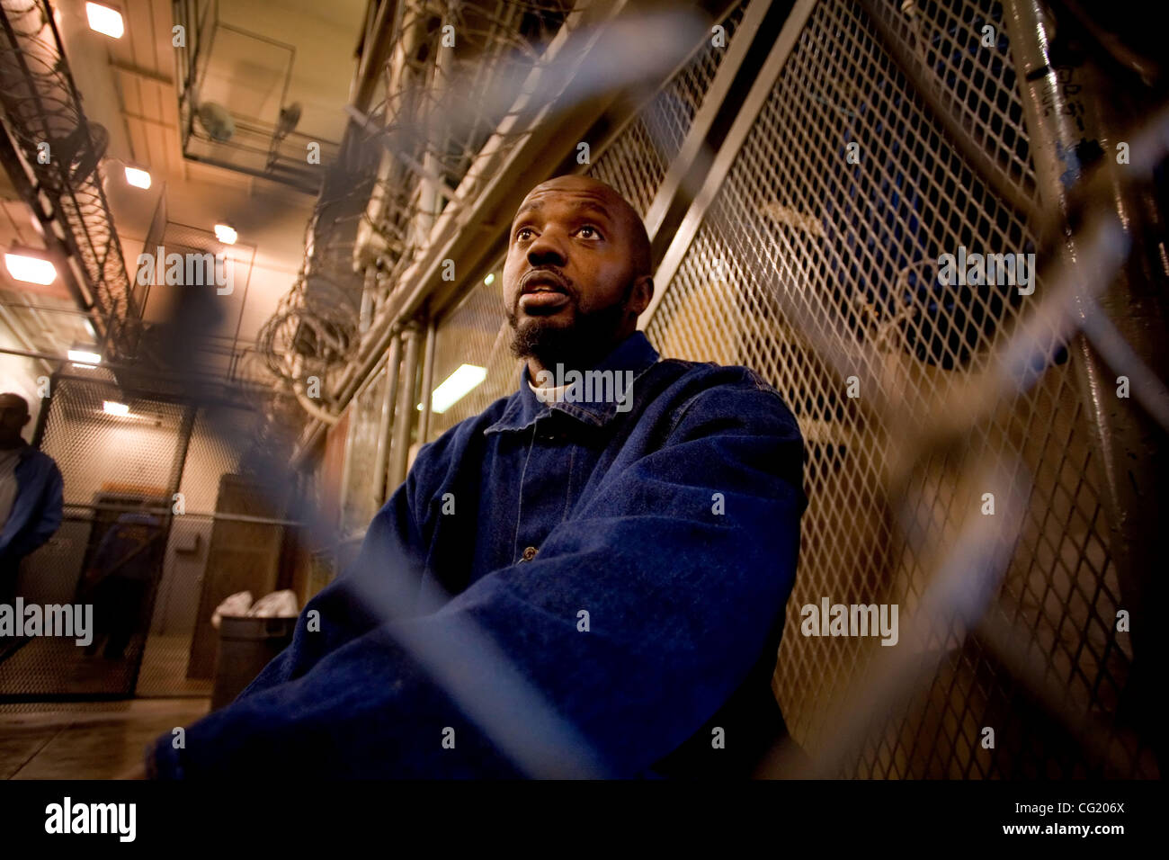 Folsom Prison inmate Patrick Glee, sits in a holding cell for the ...