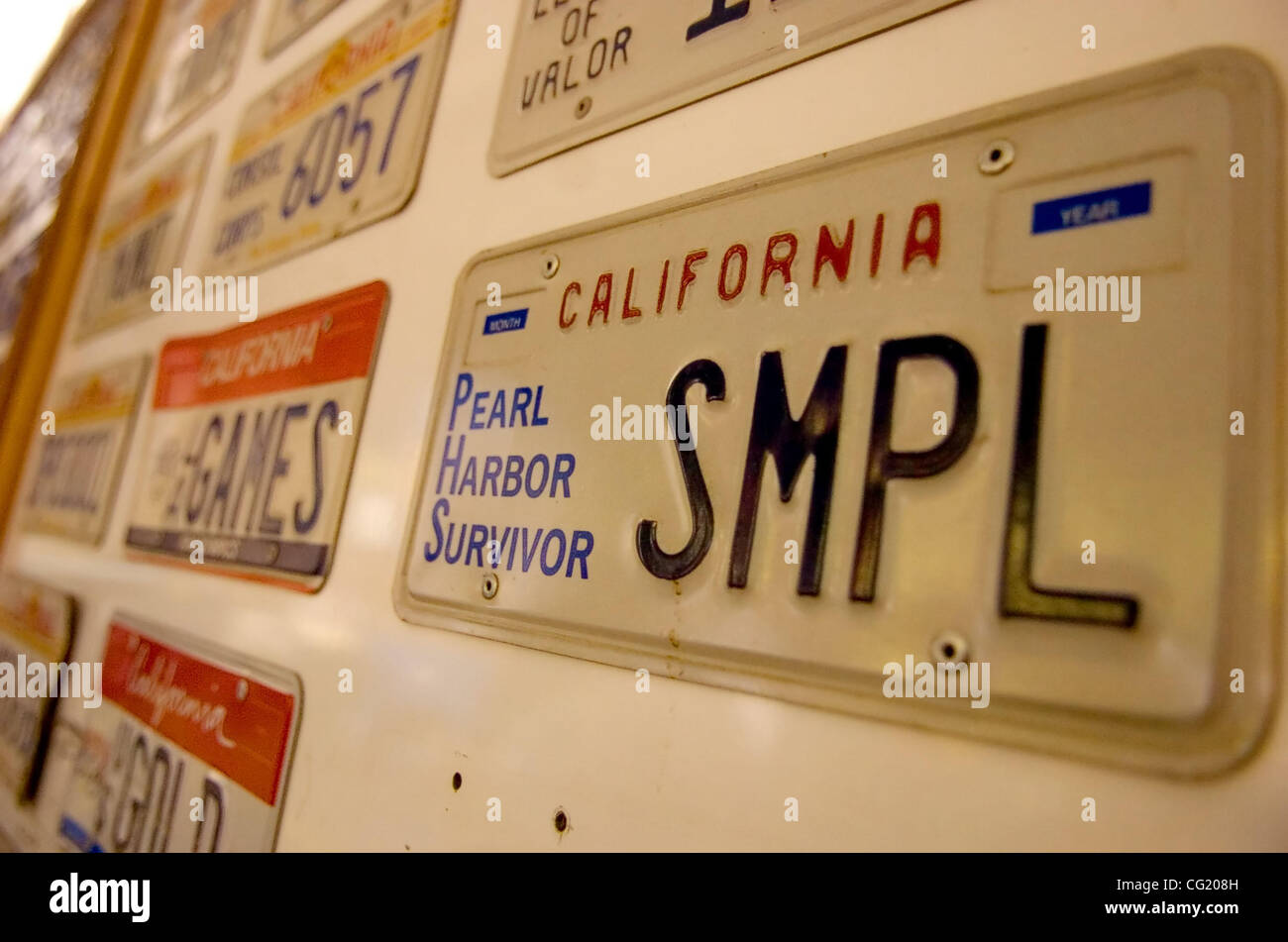 A sample license plate sits on display on the wall at Folsom Prison ...