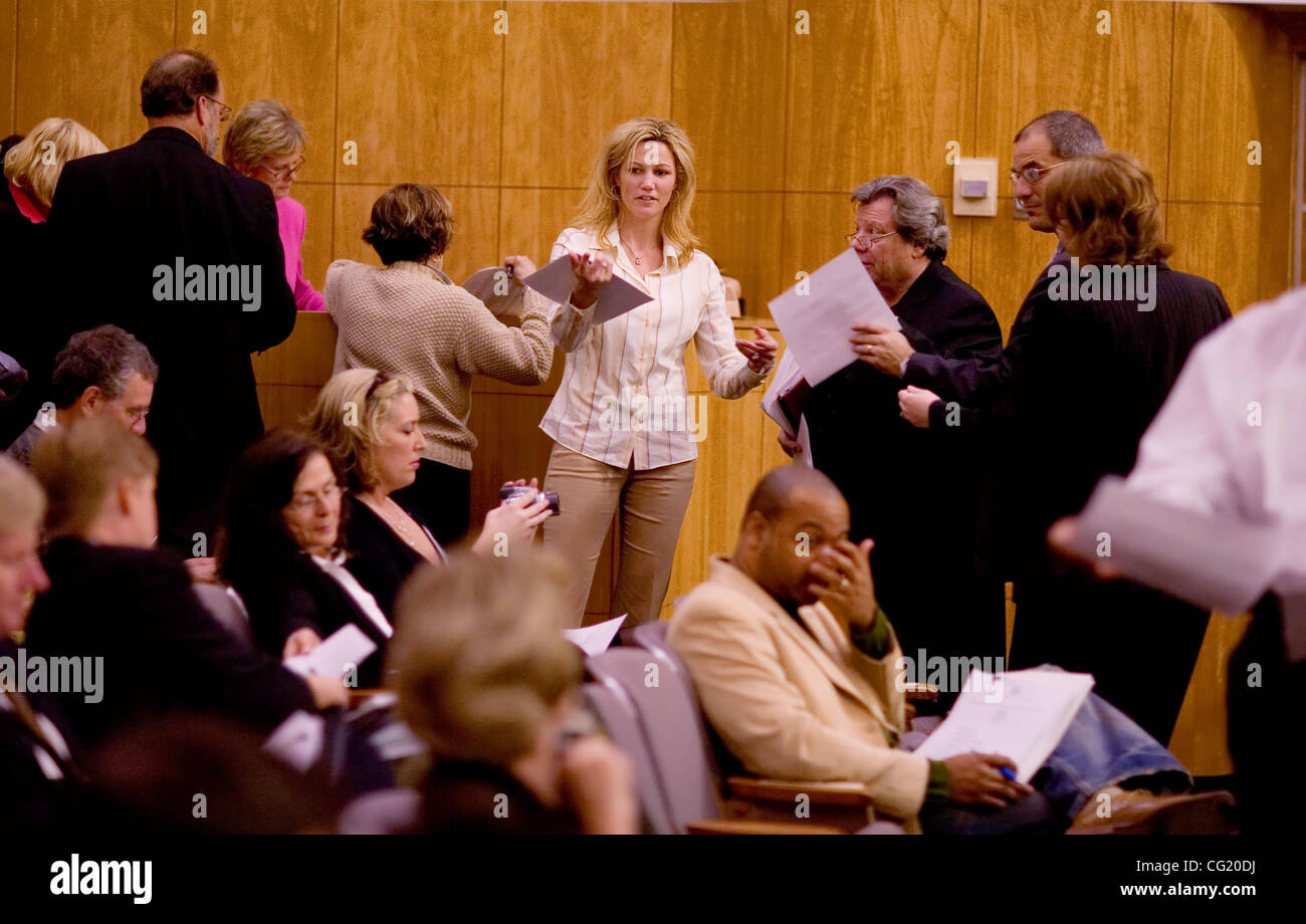 Debbie Price of the Department of Fiance, hands out the list of goals ...