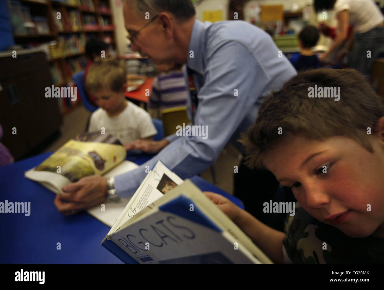 THIRD Syrus Durant 6, studies his book as Jim Parson shows a student a ...