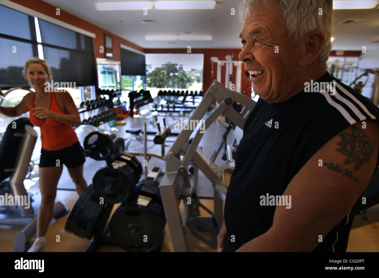 Bill holden stands inside his Tru Fitness building with Karen Pope a ...