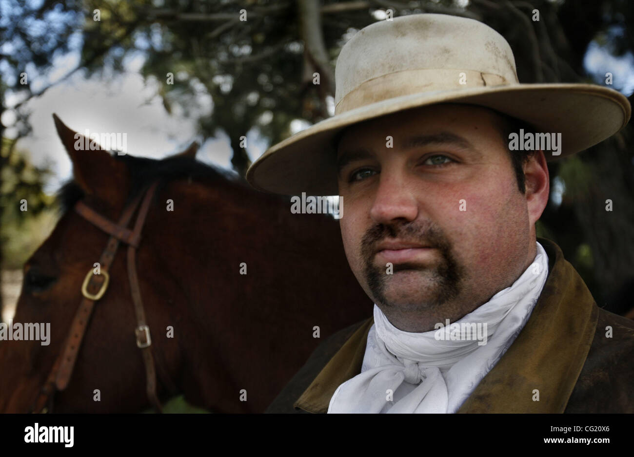 SECOND -- John Greber stands near his house and farm with his horse ...