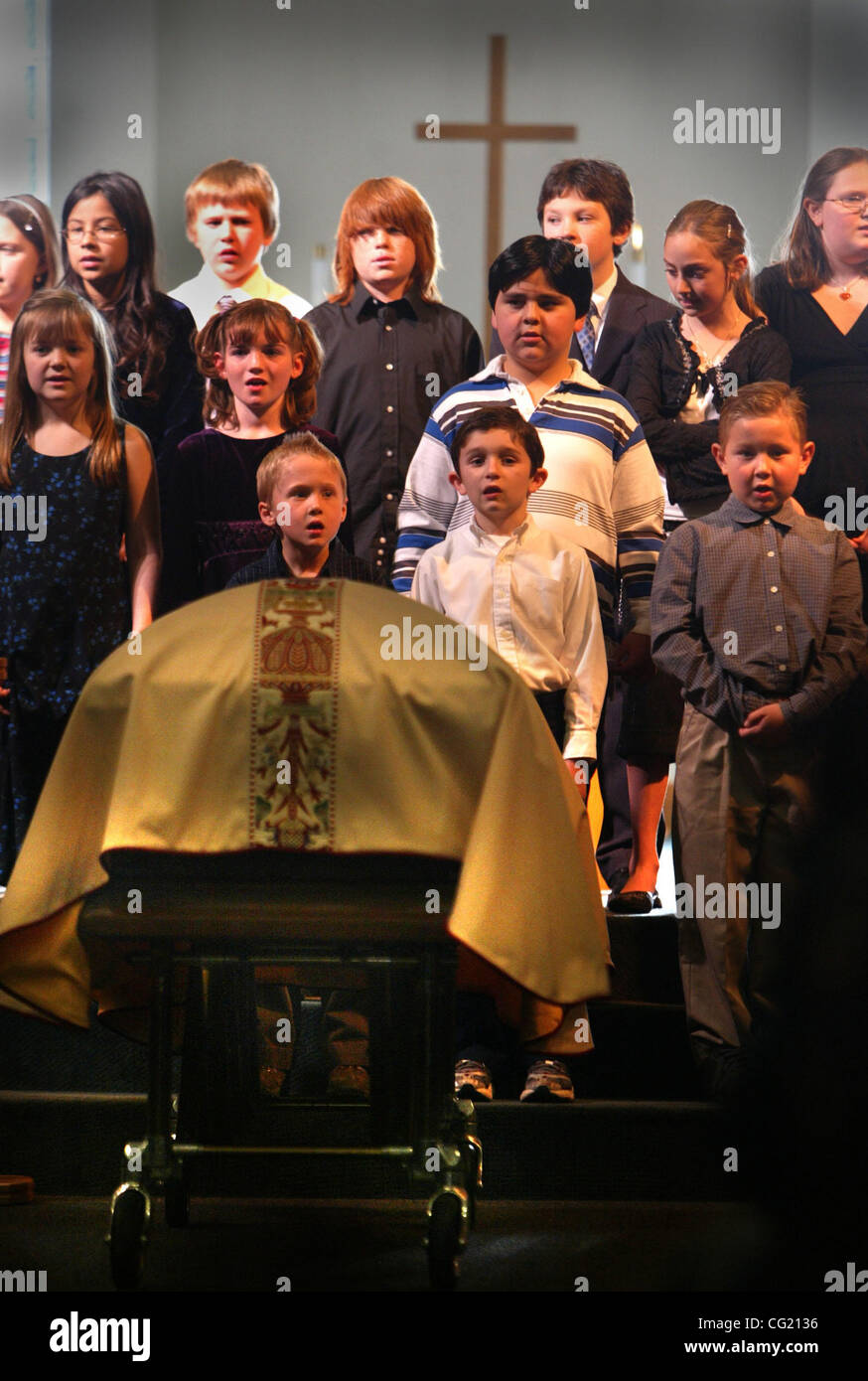 Students from Susan's school sing in front of Susan McNew's casket ...