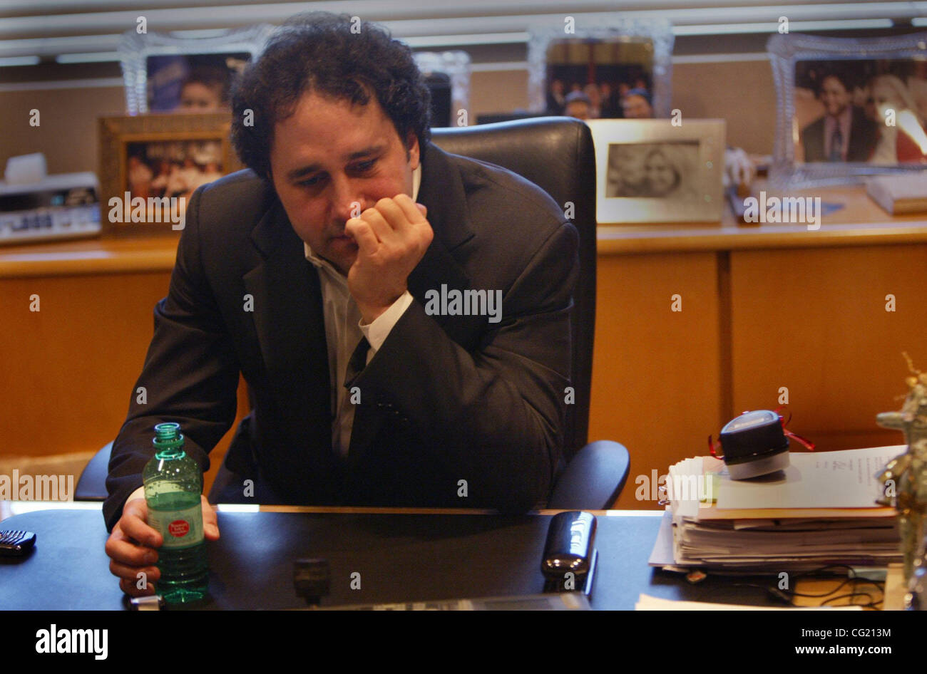 George Maloof sits at his desk at the Palms with family photos in the ...