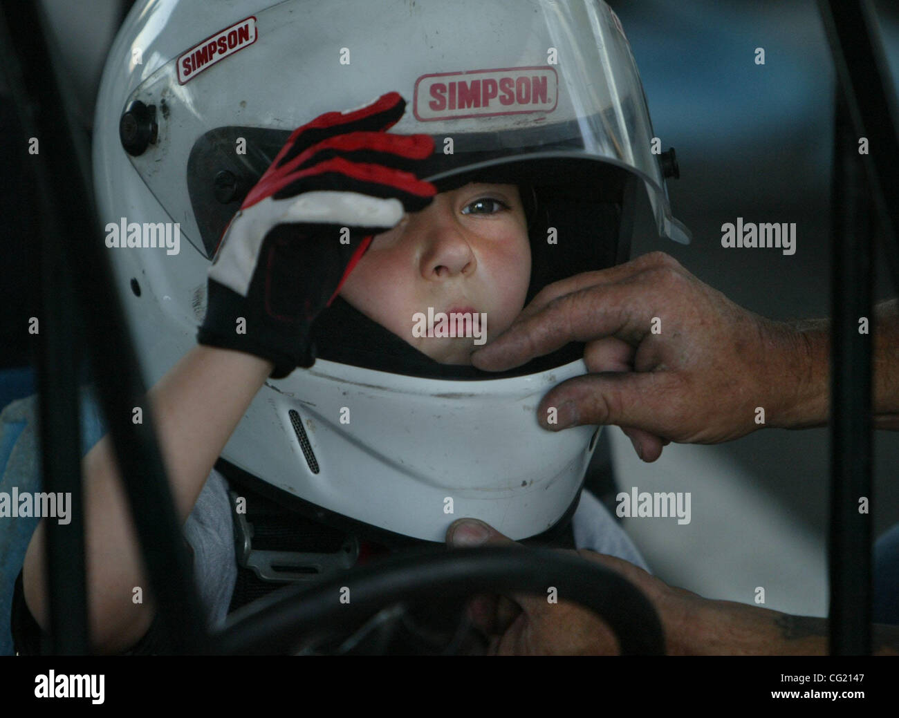 As her family watches on Angelika Gullette, gets a helmet put on by ...