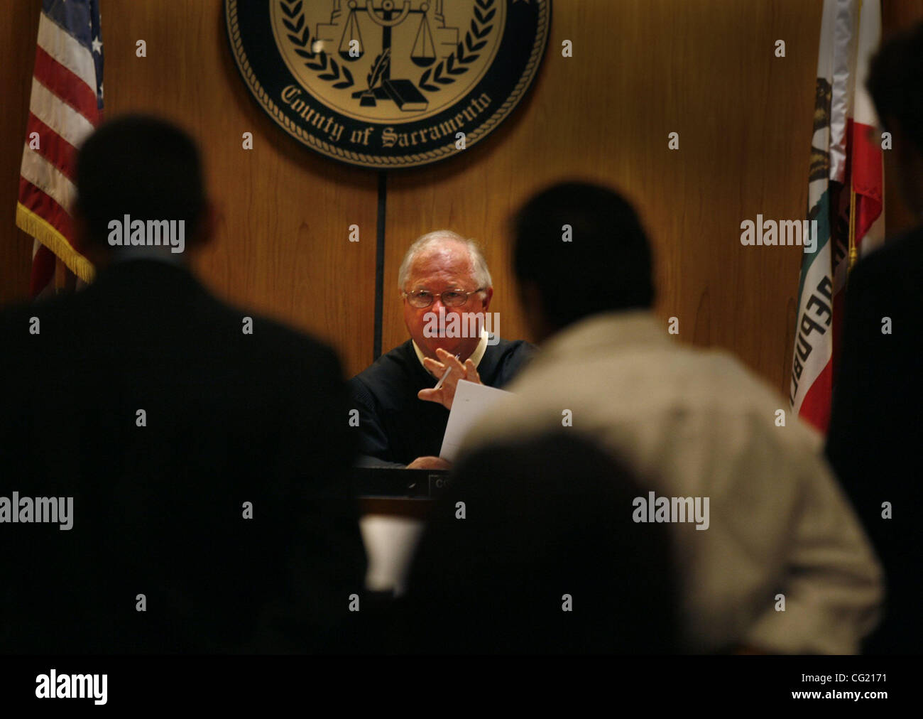 SECOND Phil Stanger talks to defendents and lawyers during sentencing ...