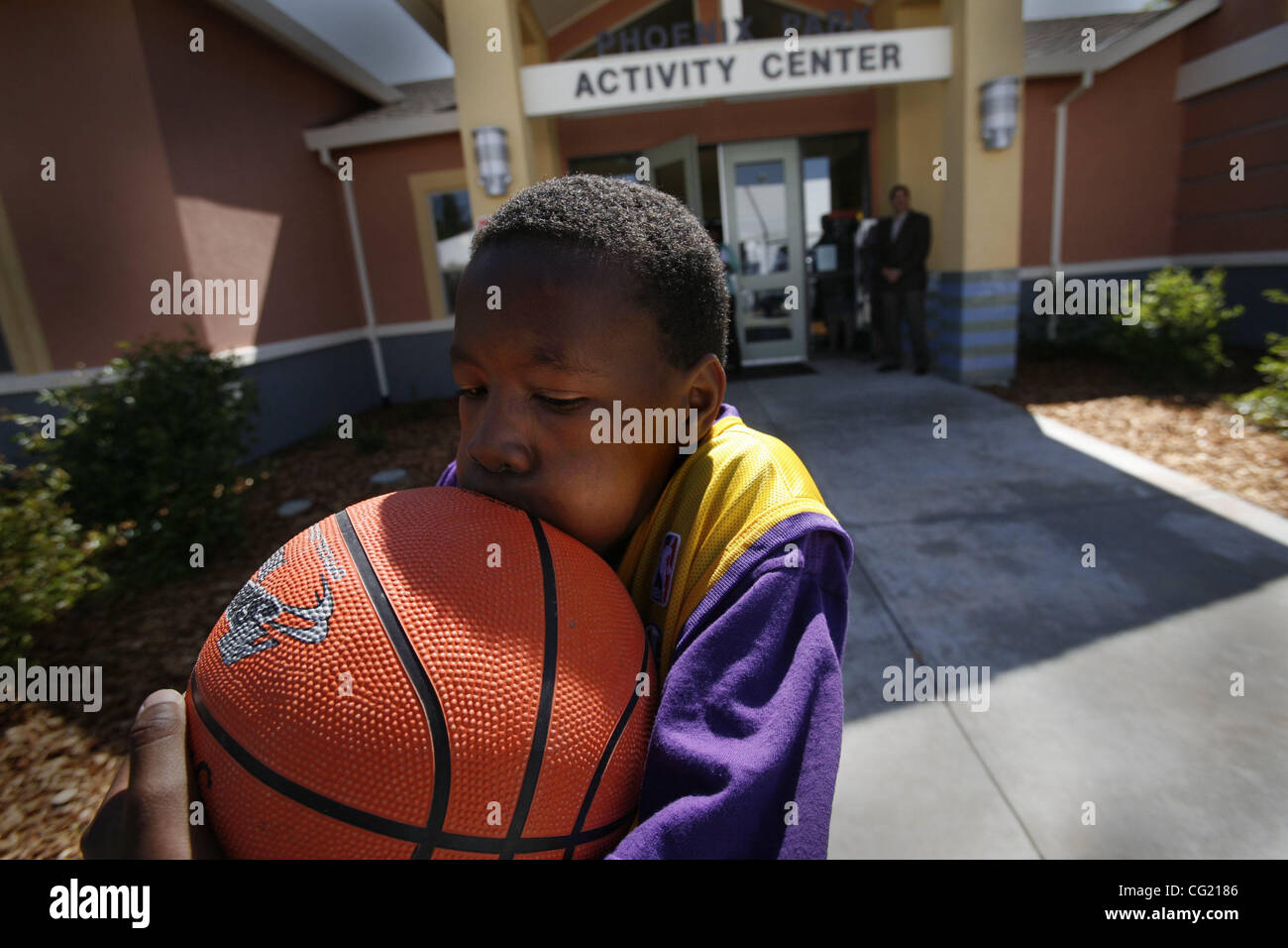 Mark Levingston 8, tries to blow up his new ball before Magic Johnson ...