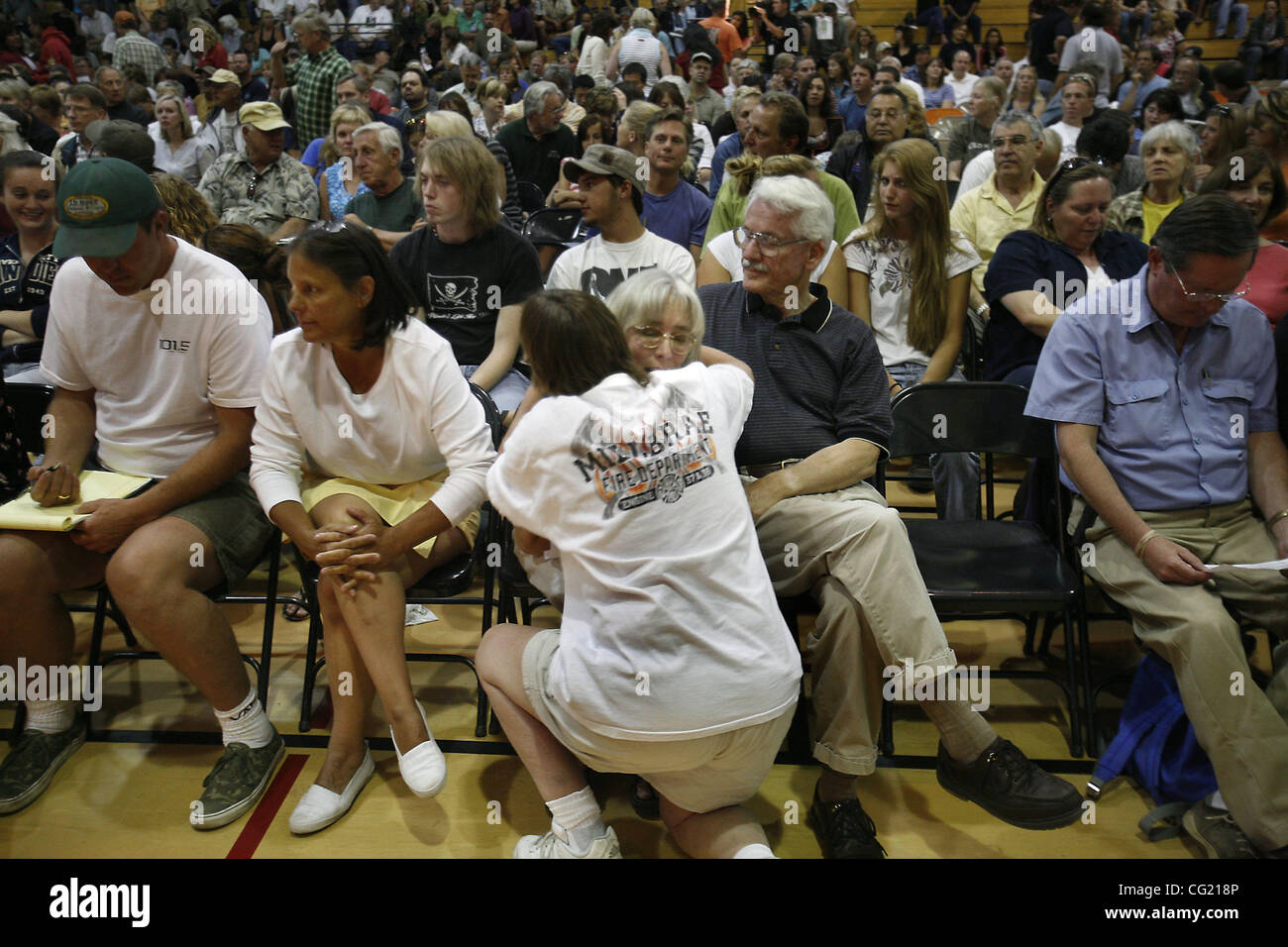 (back) Francine Tanner hugs her friend and neighbor Missy Springer ...