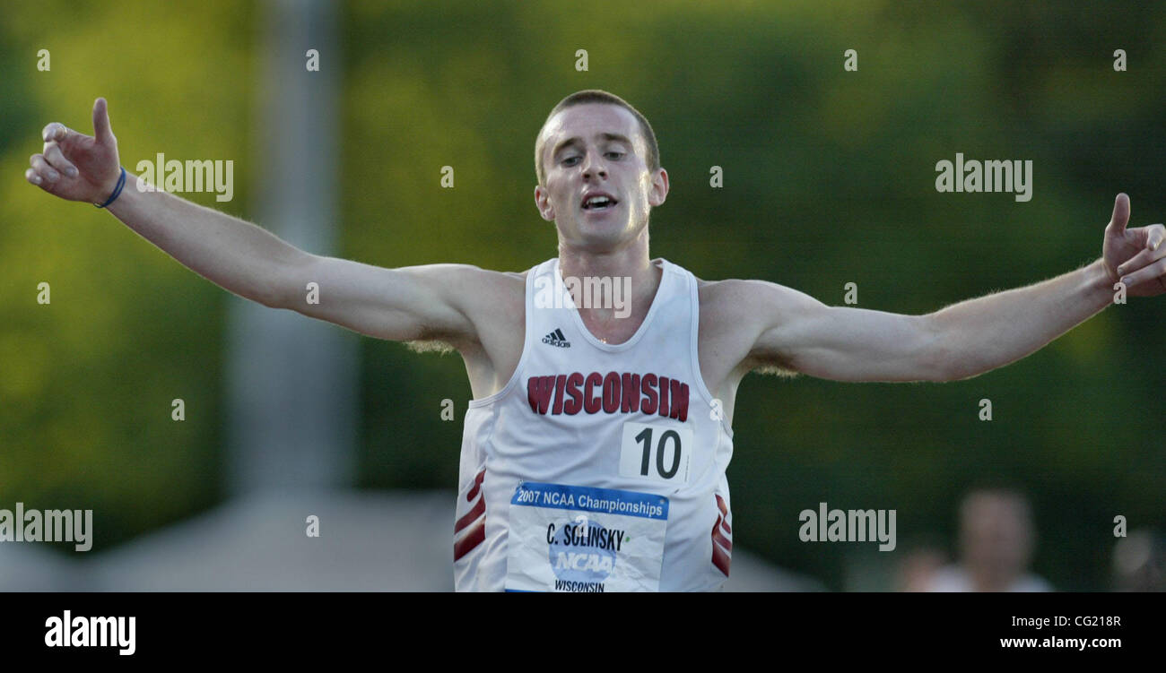 5000 meter winner Chris Solinsky crosses the finish line in 13:35 ...