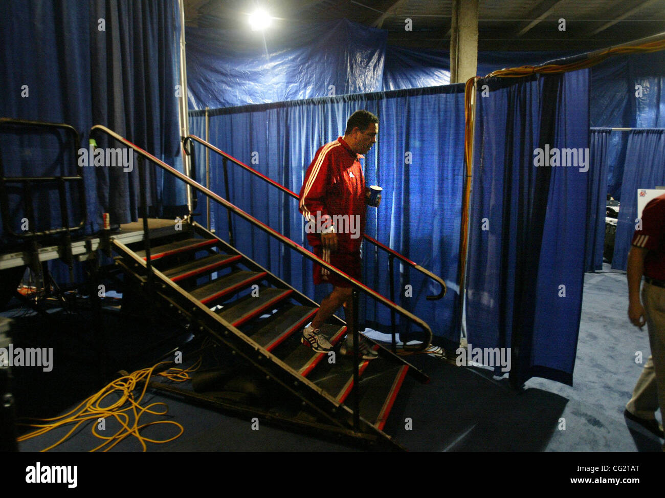 Out the back, Indiana head coach Kelvin Sampson makes his way down the ...