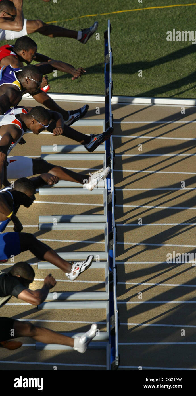 Atheletes go over the first hurdle in the 110 hurdles semifinal ...