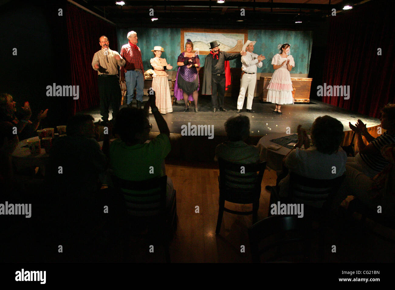 Actors on stage at the end of the show get an applaud from audience ...