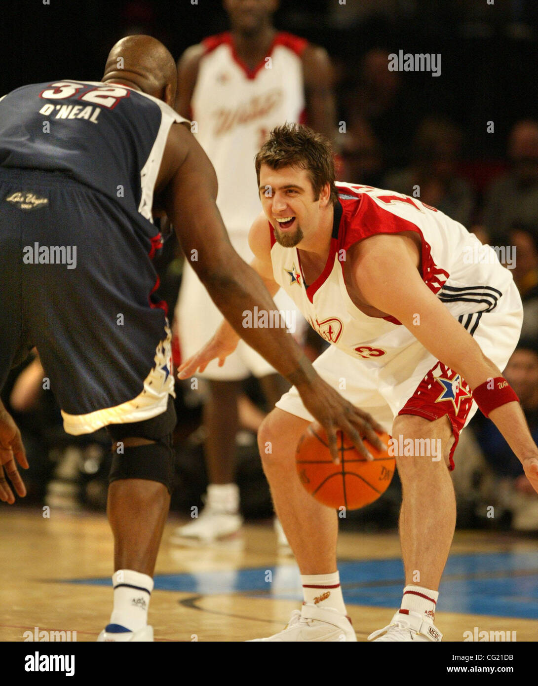 Putting the moves on the big man Shaquille O'Neal brings the ball up ...