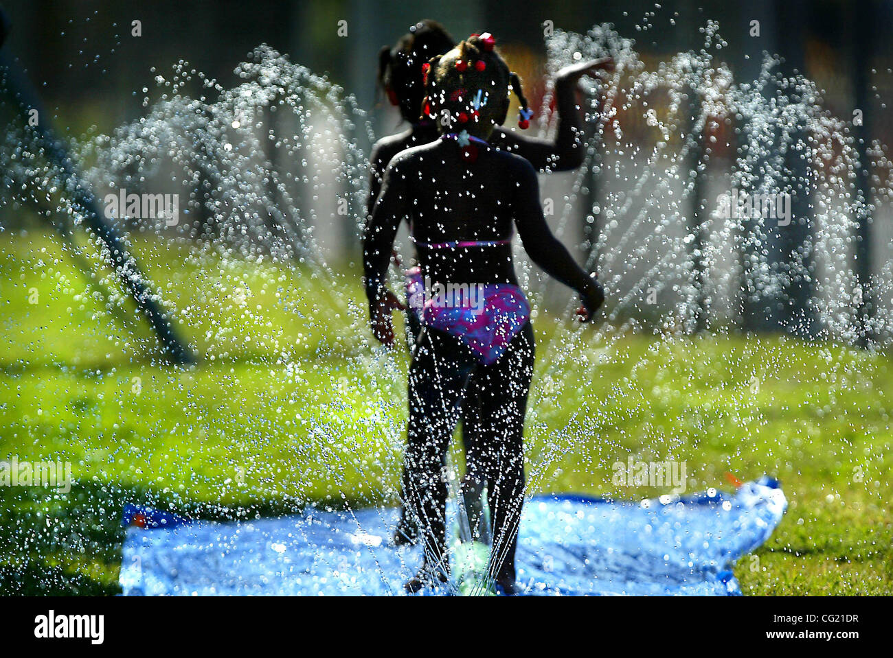 Enjoying the Sacramento heat near the front of their home Maklya Ellis ...