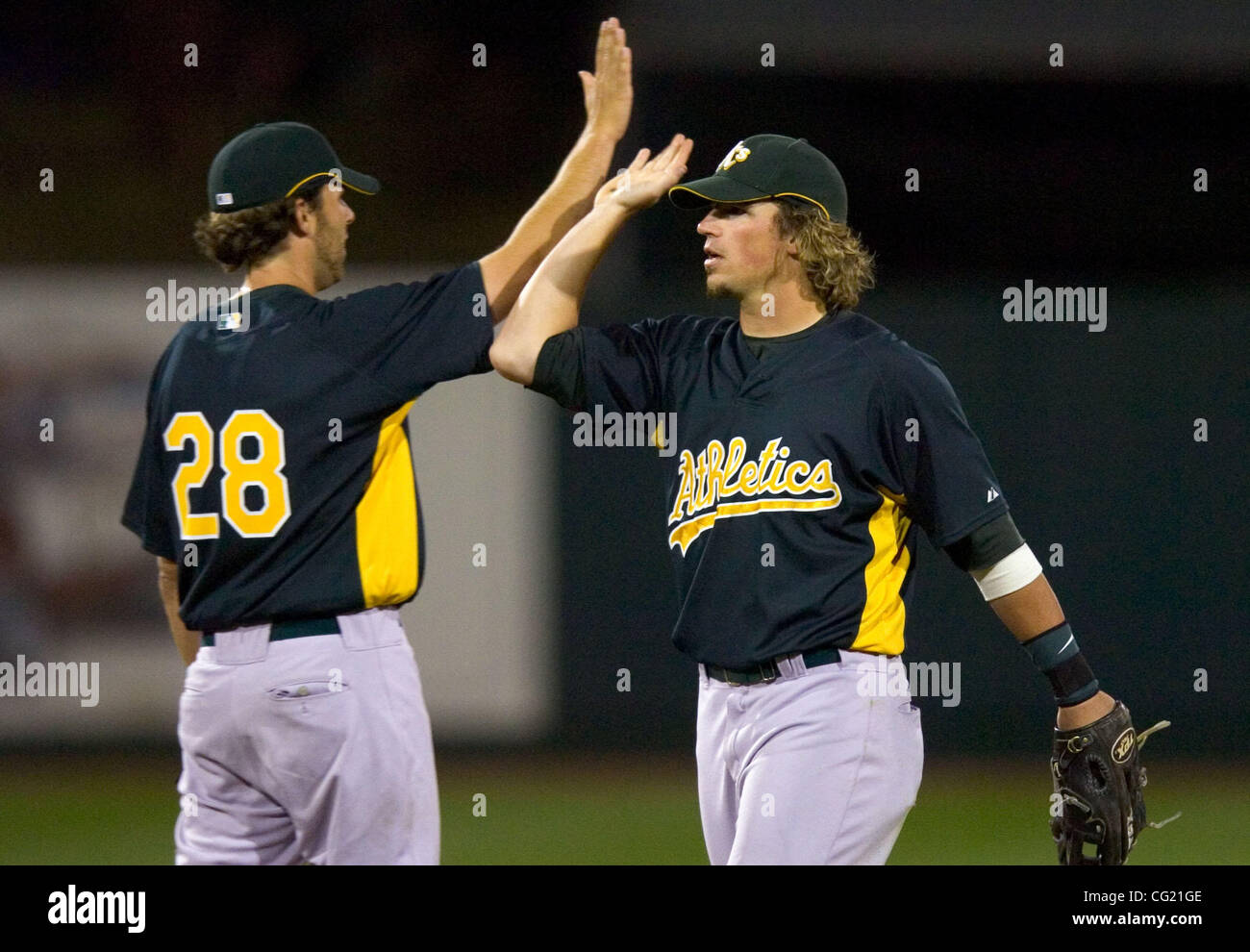 Oakland's Travis Buck, right, celebrates the Athletics' 11-10 victory ...