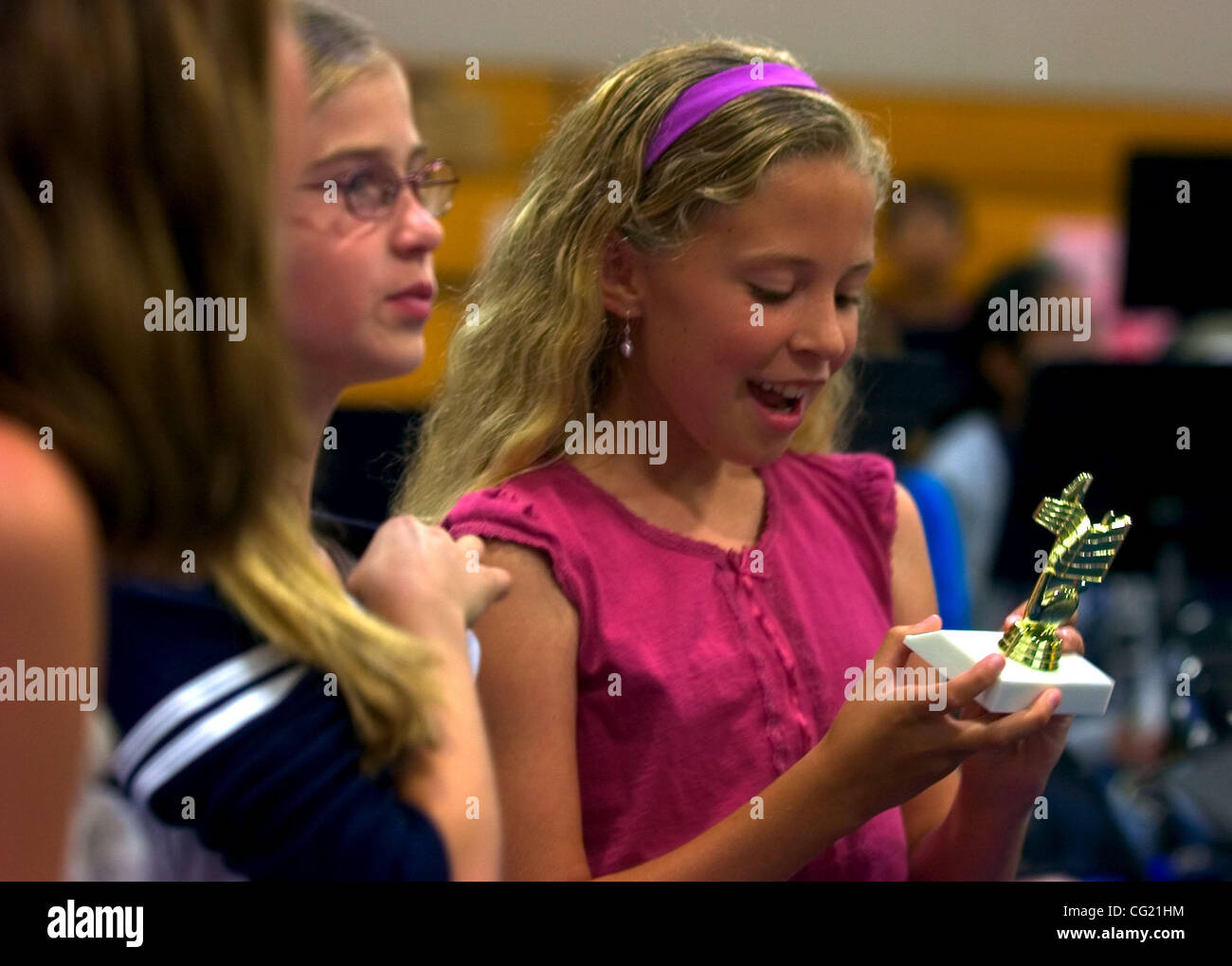 Hannah Cain looks over her Outstanding Musician award during a joint ...