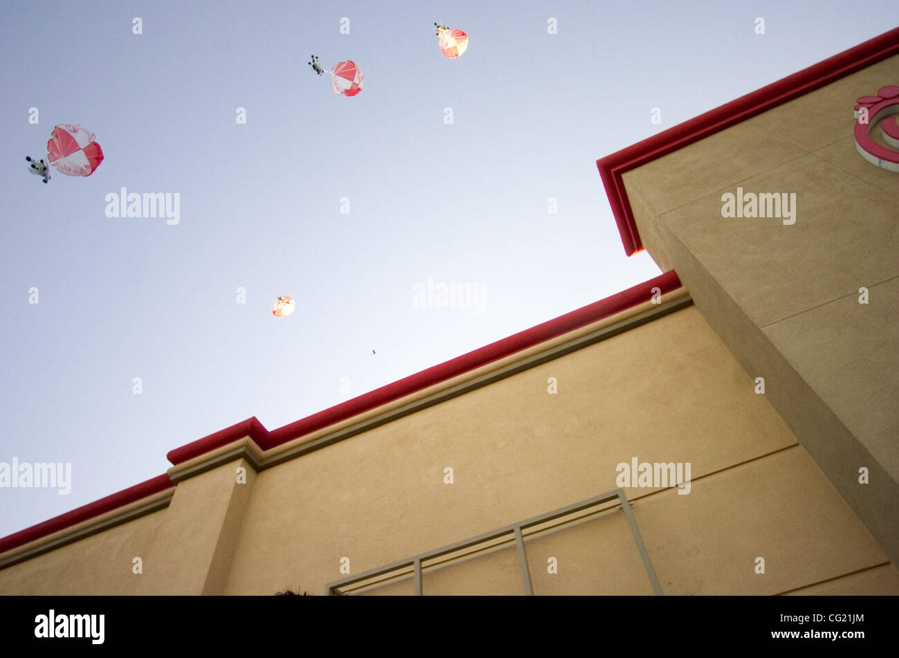 Chick-Fil-A promotional toys rain down on the parking lot of one of the ...
