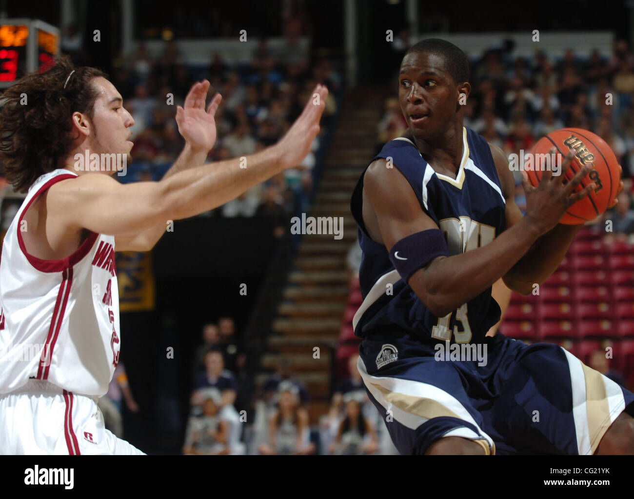 Oral Roberts Moses Ehambe looks to pass past Washington State's Derrick ...