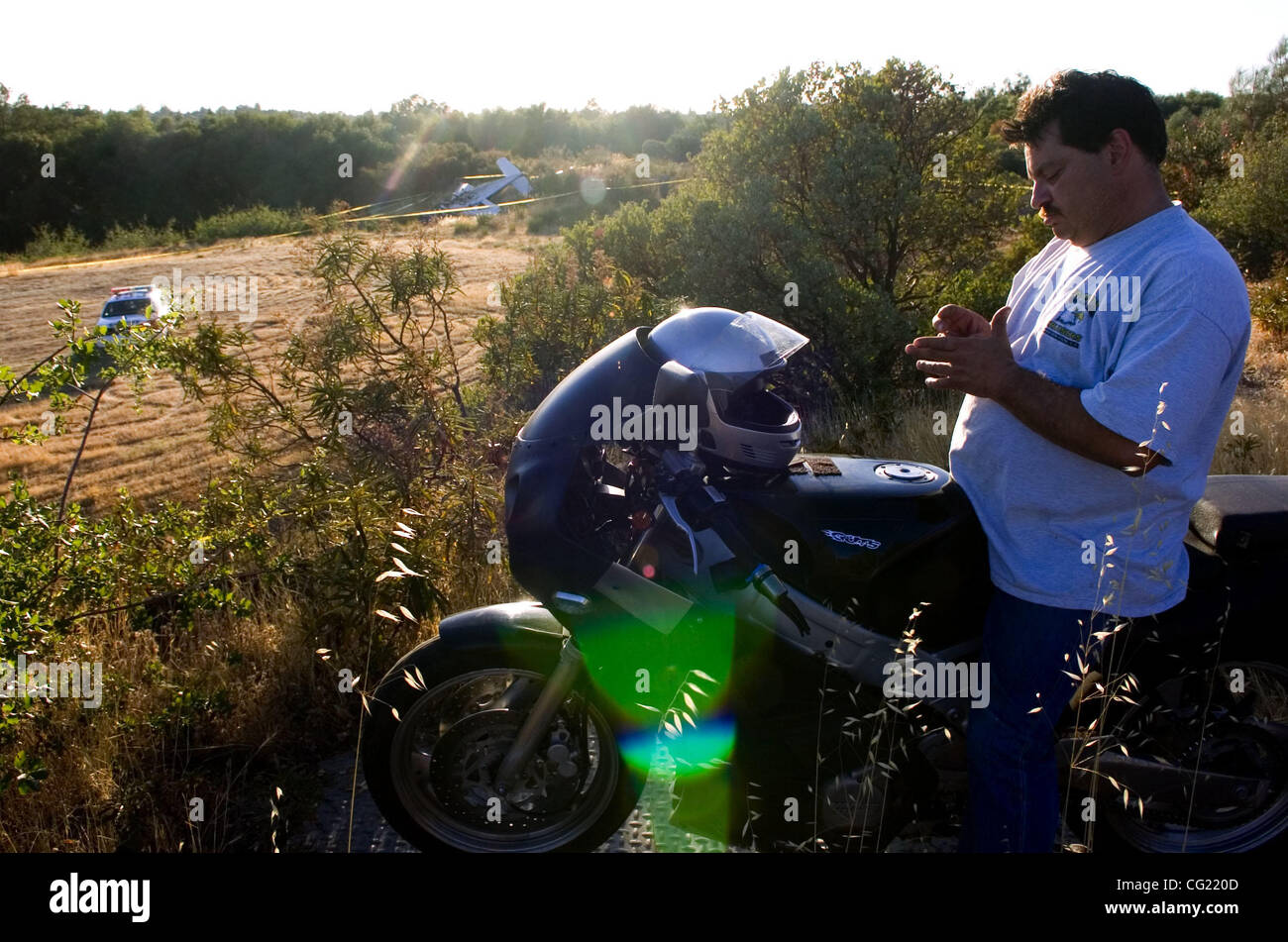 Scott Fernandez pulled his motorcyce off the road to view the scene of ...