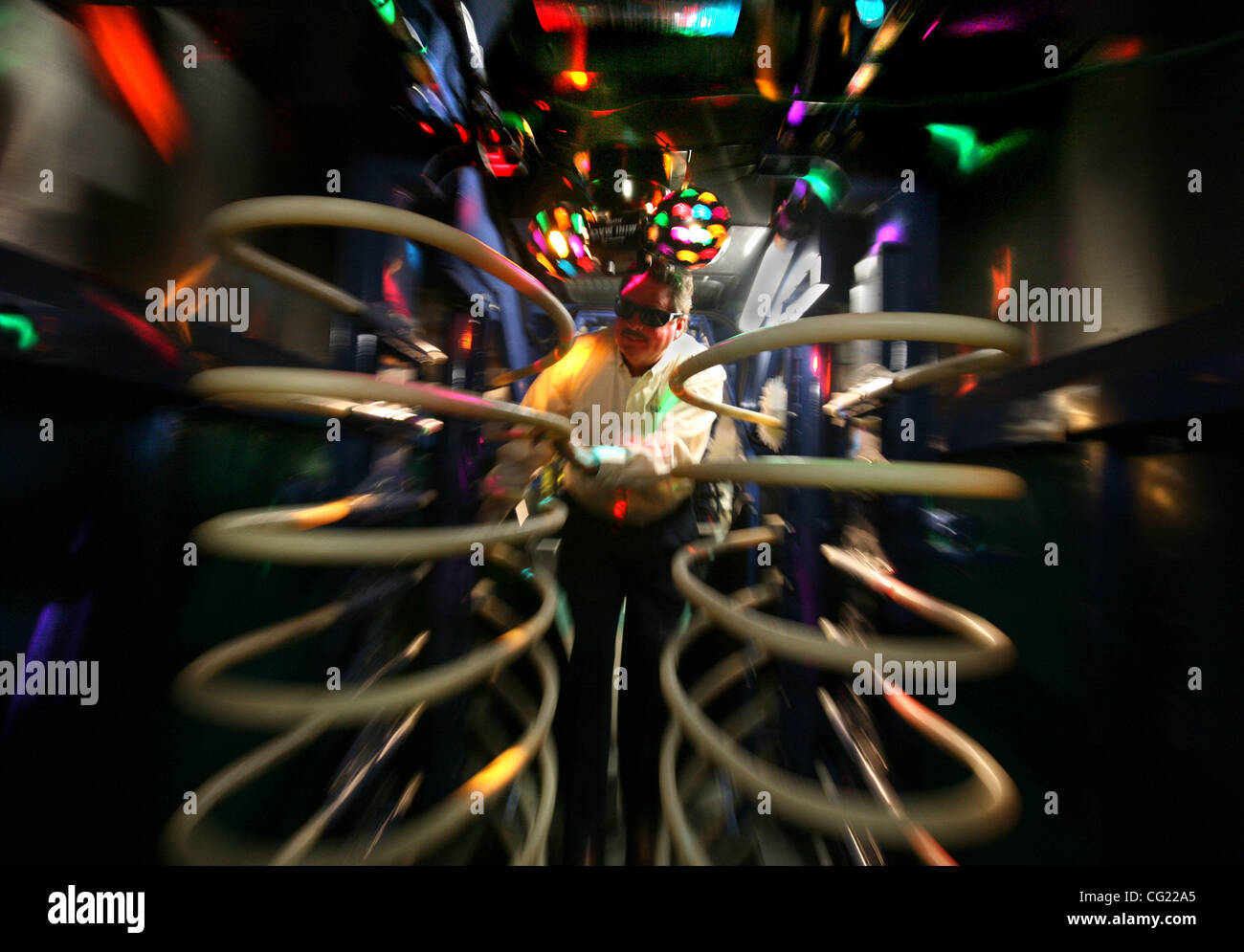 Exhibitor Mitch Ritchie from OXBO International looks inside his super ...