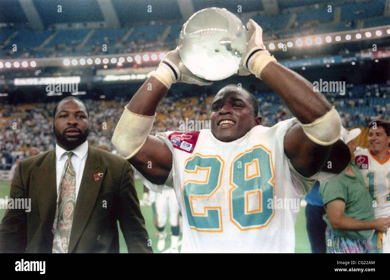 Surge running back Tony Burse (28) holds the World League trophy high ...