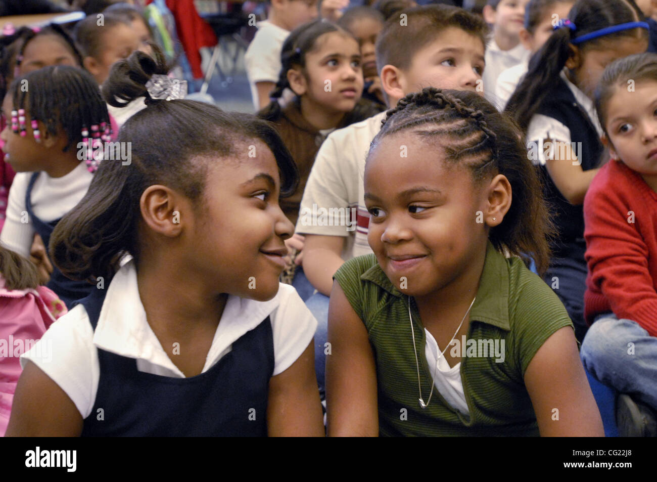 LEDE From left, Isayla Dorrough, 6, and Jaylynn Pernell, 5, exchange ...