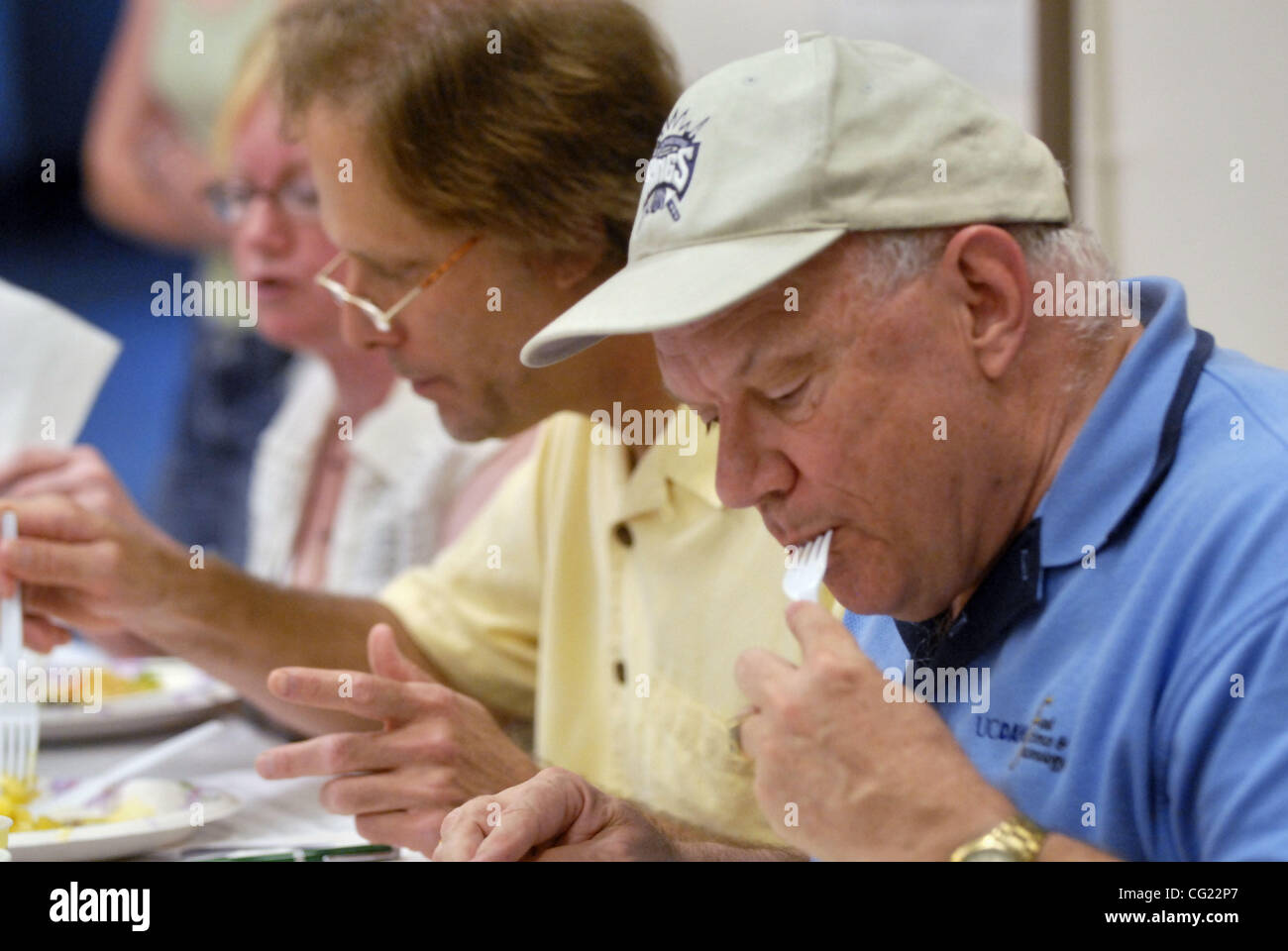 Food judges, from left, Karen Jo Hunter, John Ashby, and Gerry Russell ...