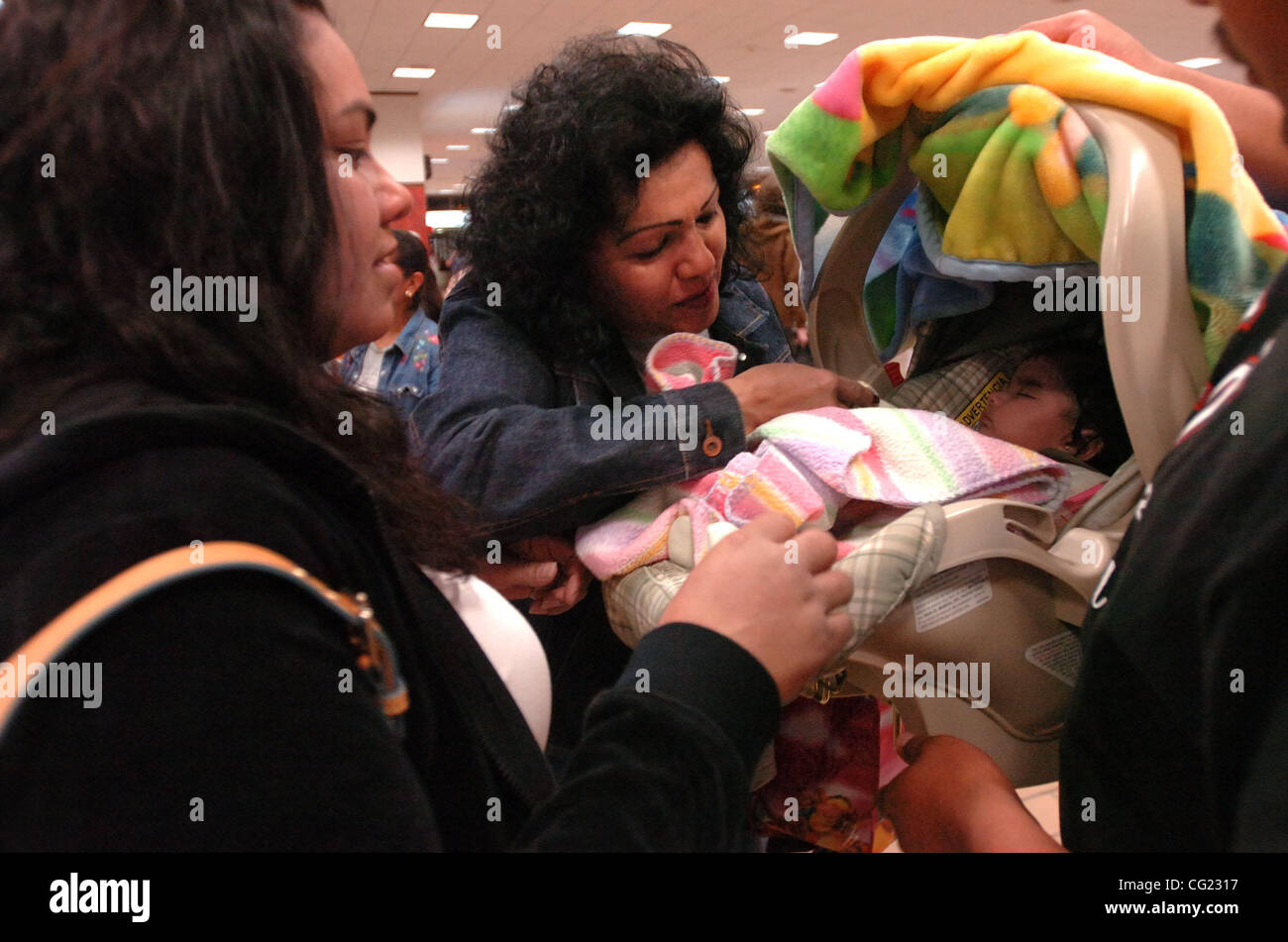 Sally Gutierrez, 51, of Sacramento, touches her six-month-old ...