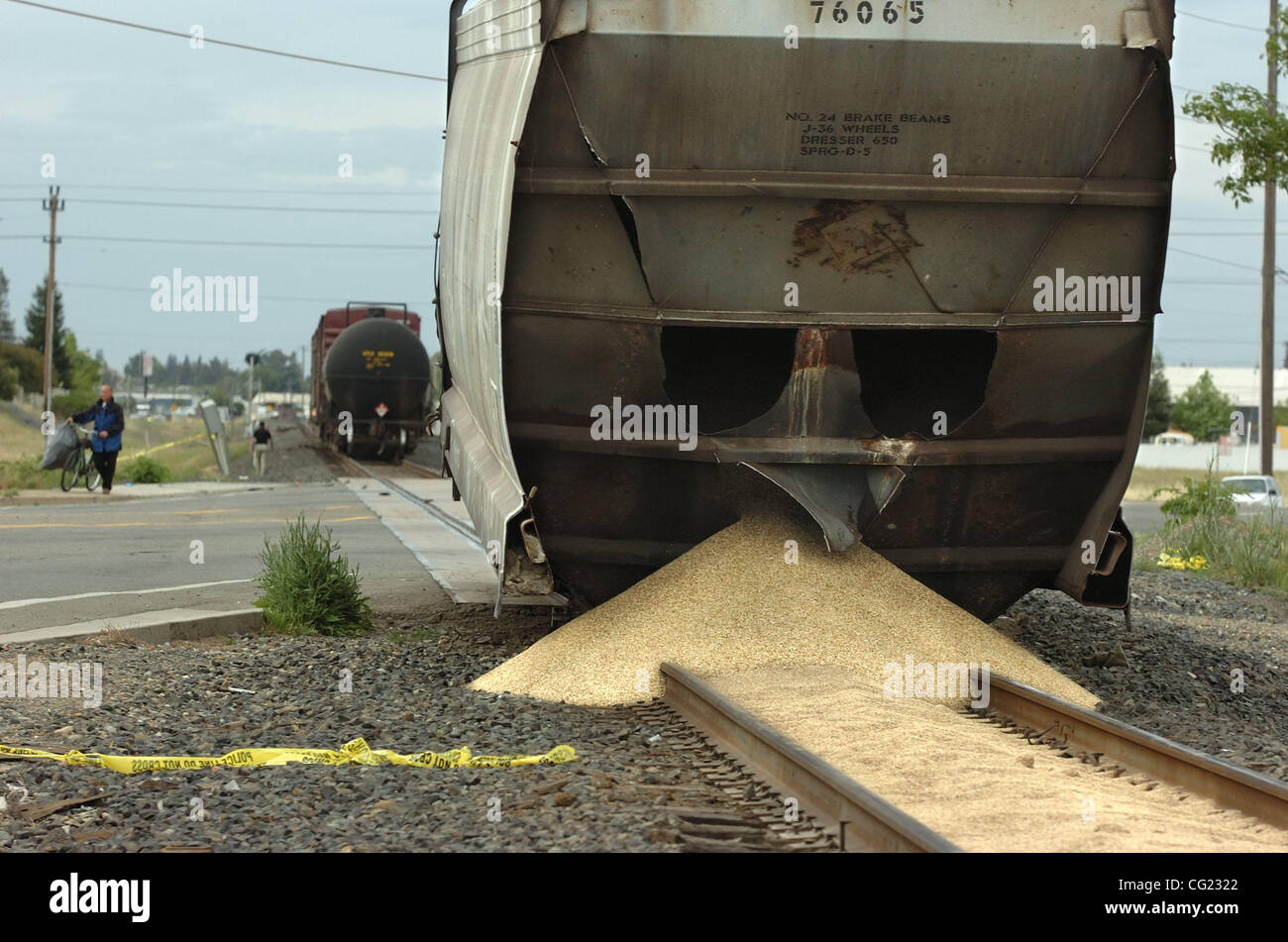 A derailed boxcar that lost the rear axle sits on the Union Pacific ...
