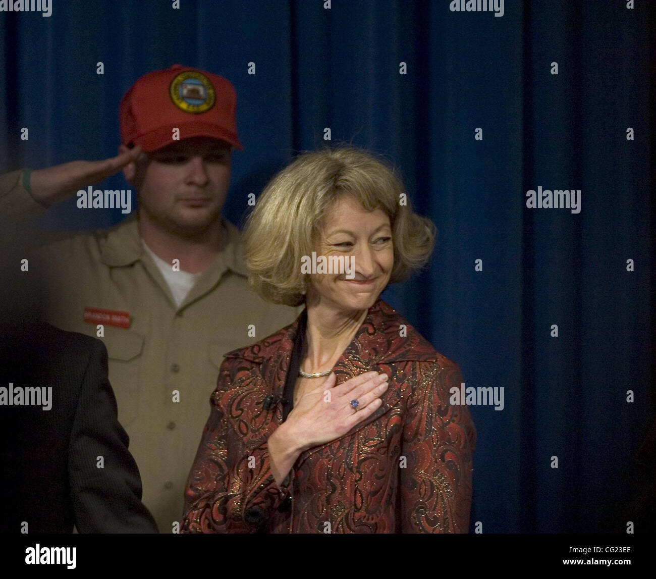 Newly elected Secretary of State, Debra Bowen (center) holds her right ...