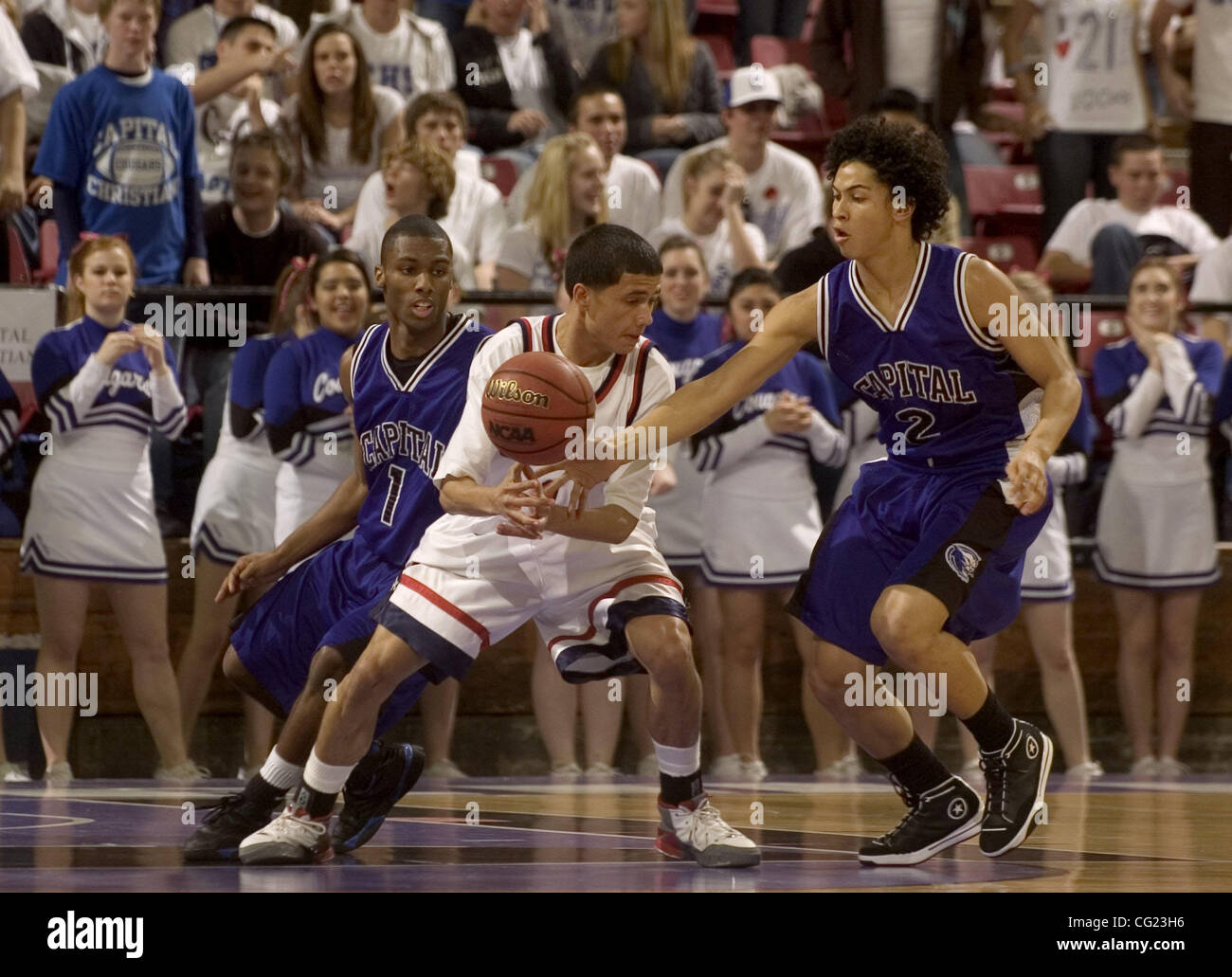 Capitol Christian Cougars #2 Xavier Walton strips the ball away from ...