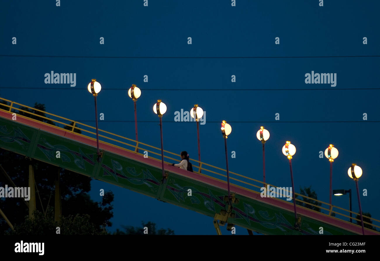 FLORIN ROAD -- A child makes the long walk up the stairs of the Super ...