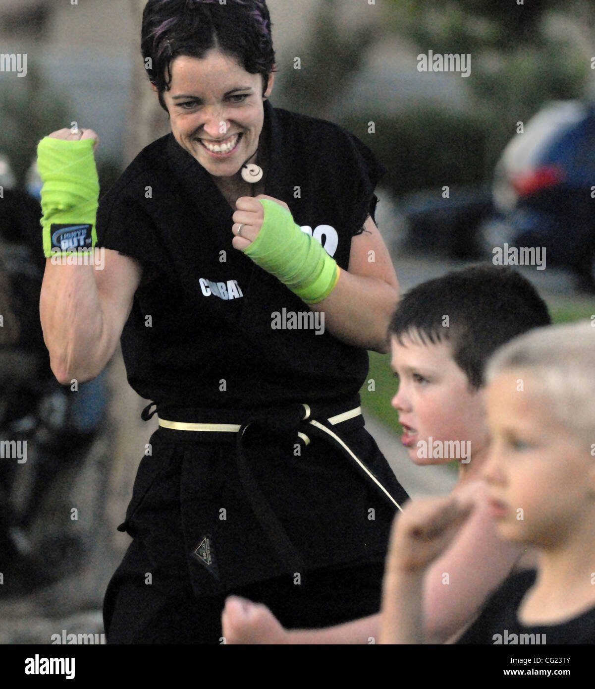From left, Tru Fitness instructor Tiffany Ferguson (cq) guides David ...