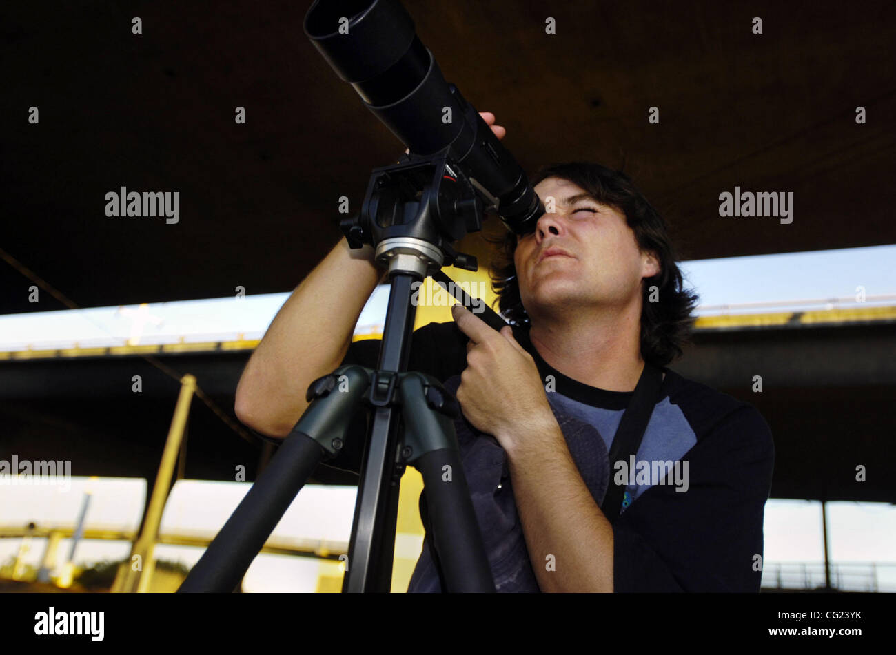 SECOND Dan Kopp (cq) uses a telescope to keep track of a colony of ...