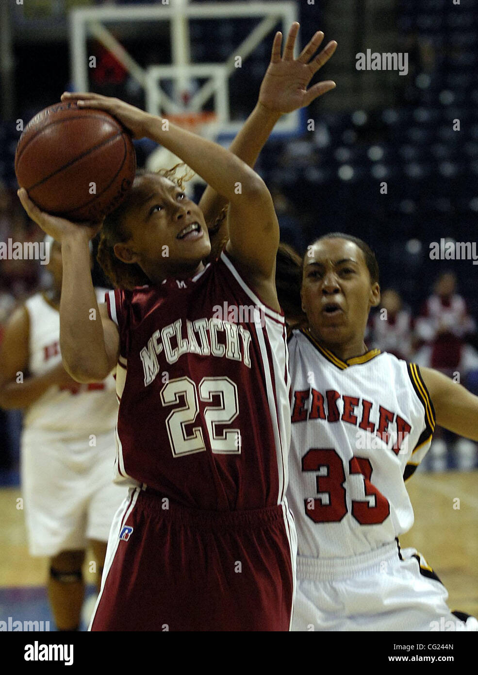 Ariel Thomas, #22, of, McClatchy High School, goes into the lane ...