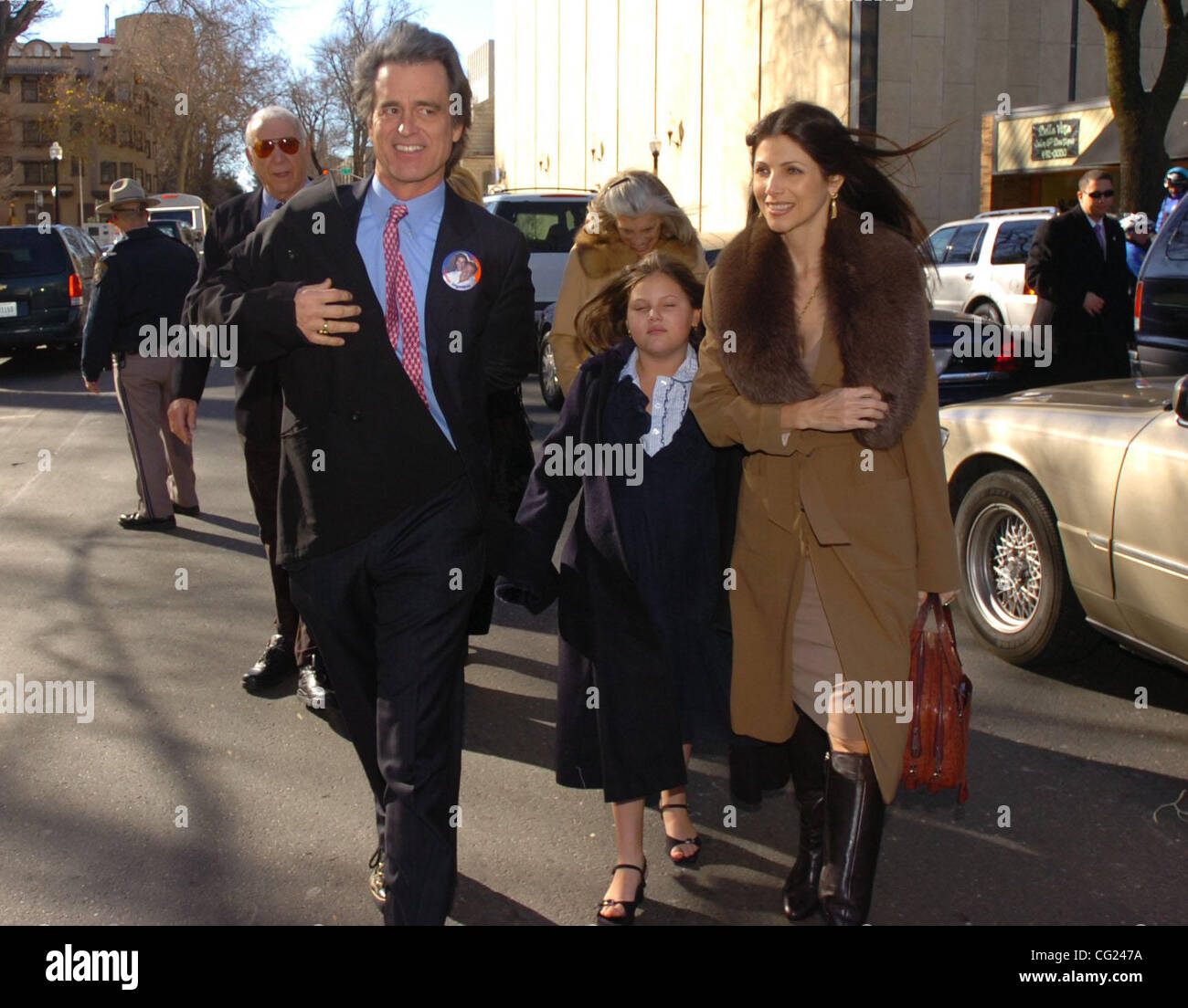 Bobby Shriver, left, brother of Maria Shriver, walks with his daughter ...