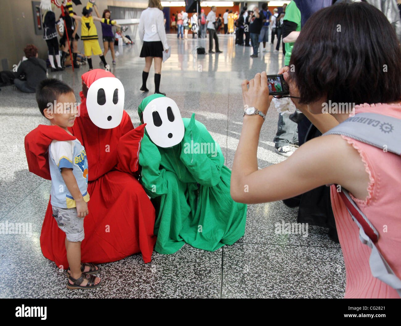A boy taking picture with Anime character during the Otakuthon Anime ...